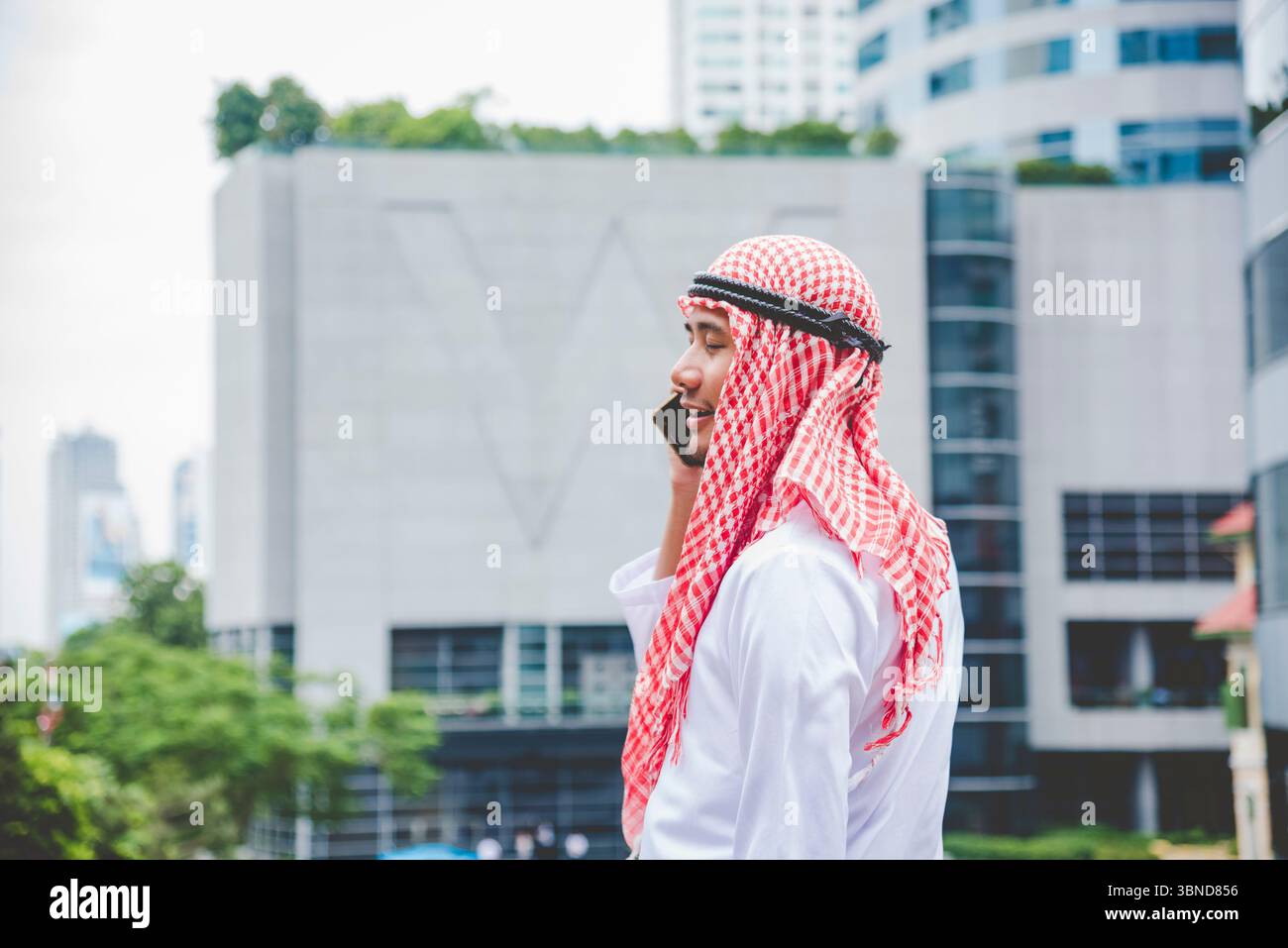 Islamic man using smartphones app organize schedule agenda focus on hands holding smartphone ...
