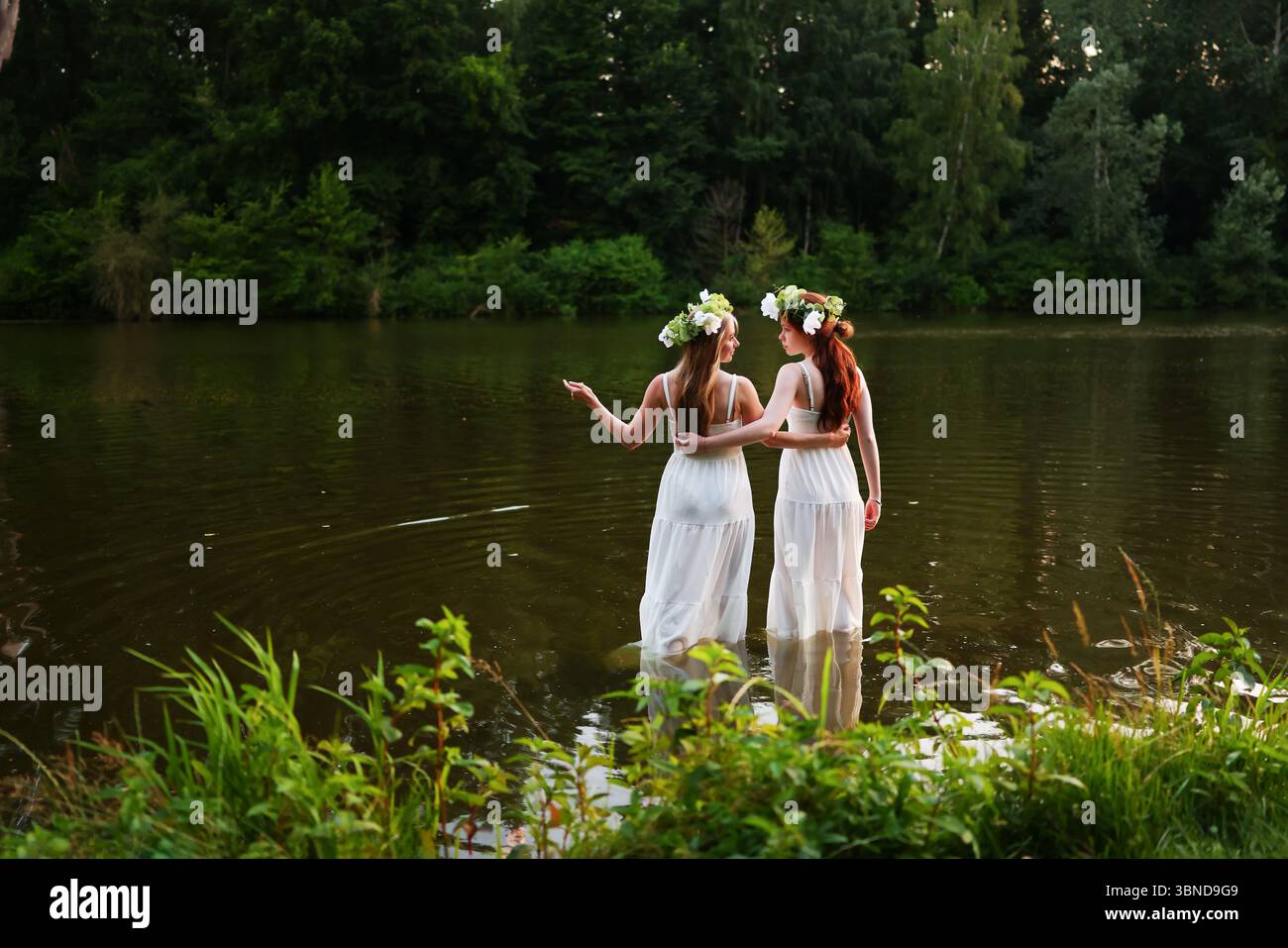 Serene moment of friendship and nature with girls embracing in ...