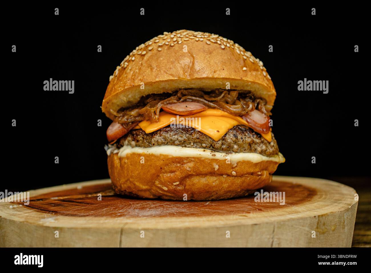 Homemade burger with brioche bread, melted cheese, special sauce, bacon ...