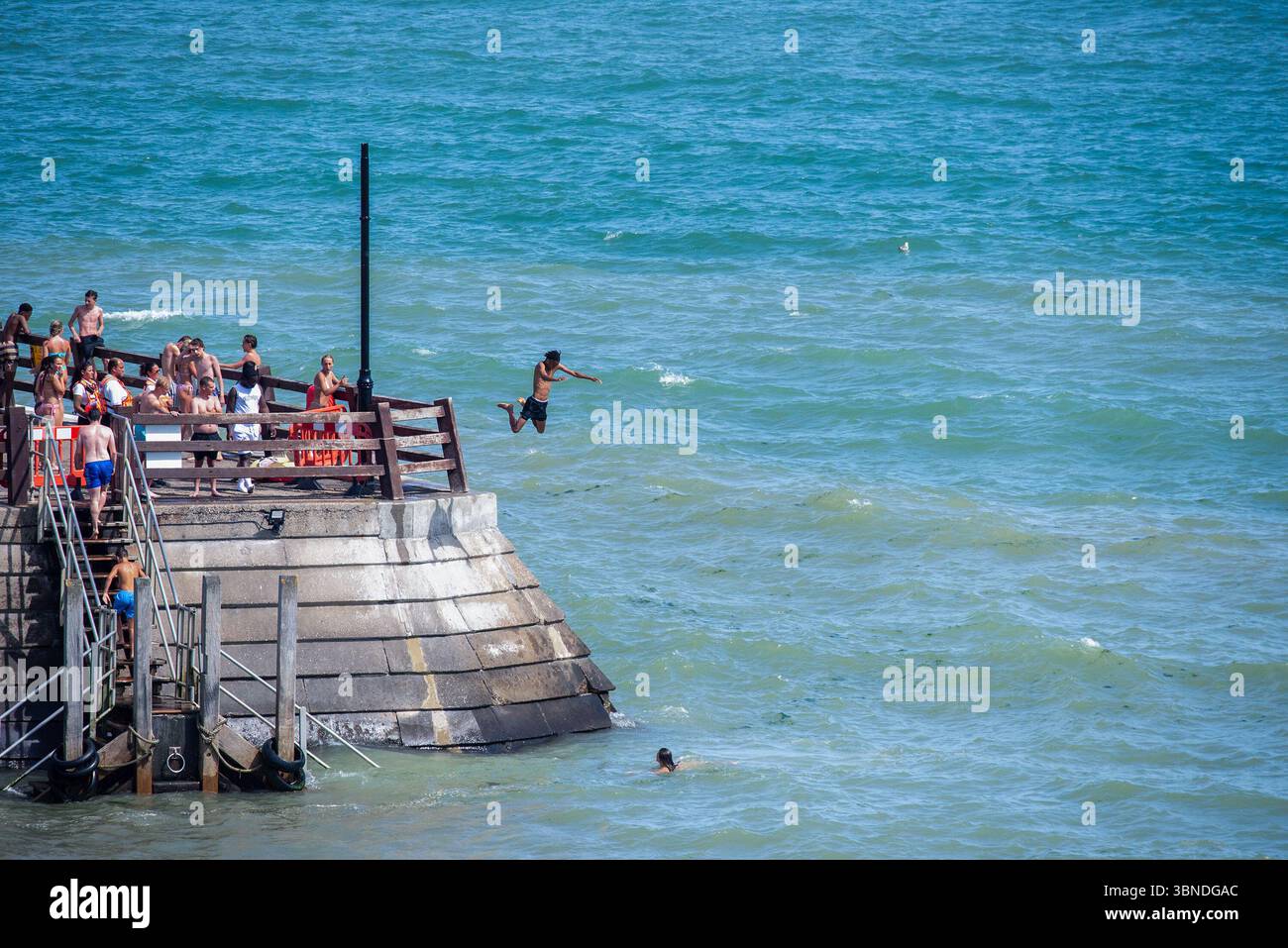Broadstairs, UK. 01st July, 2025. A young man jumps into the sea from ...