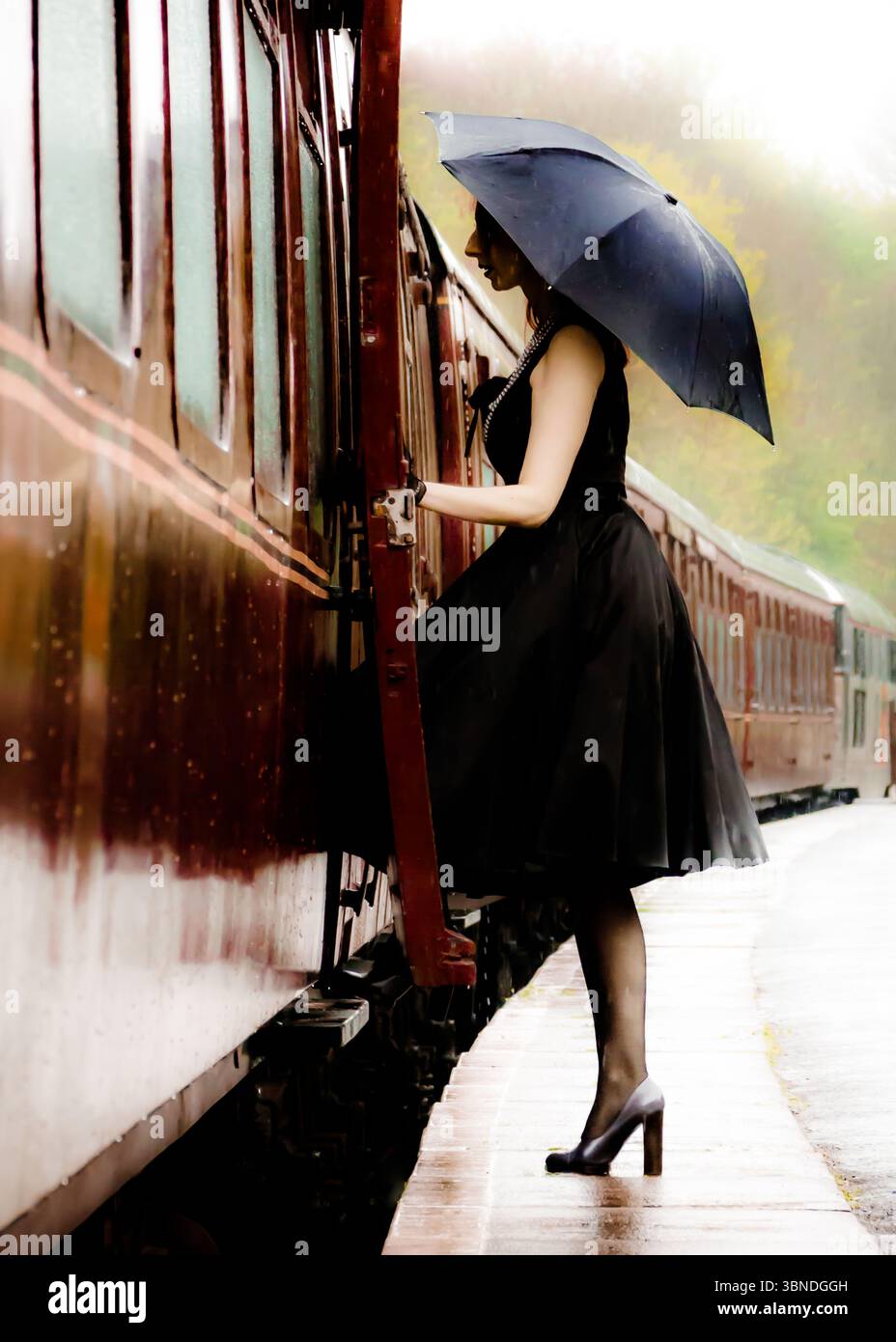 A woman in a black dress and heels steps onto a train while holding an ...
