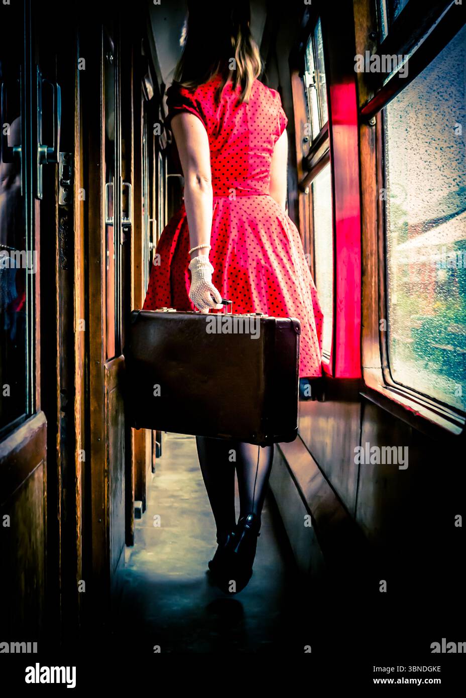 A woman in a red polka dot dress and white gloves walks down the aisle ...