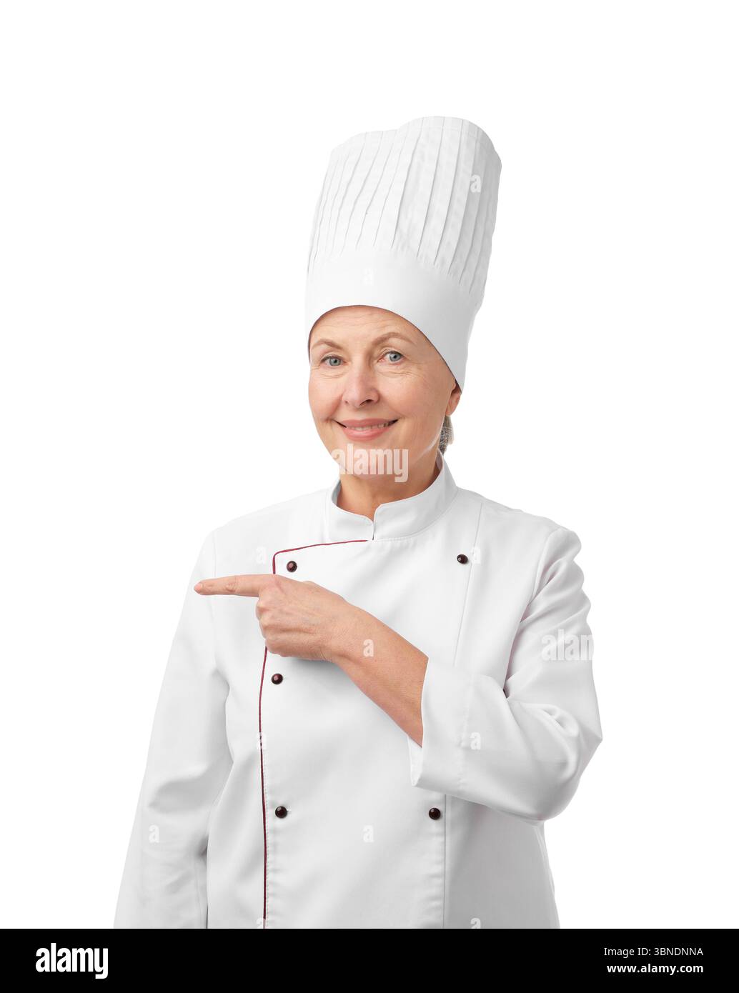 Professional pastry chef pointing at something on white background ...