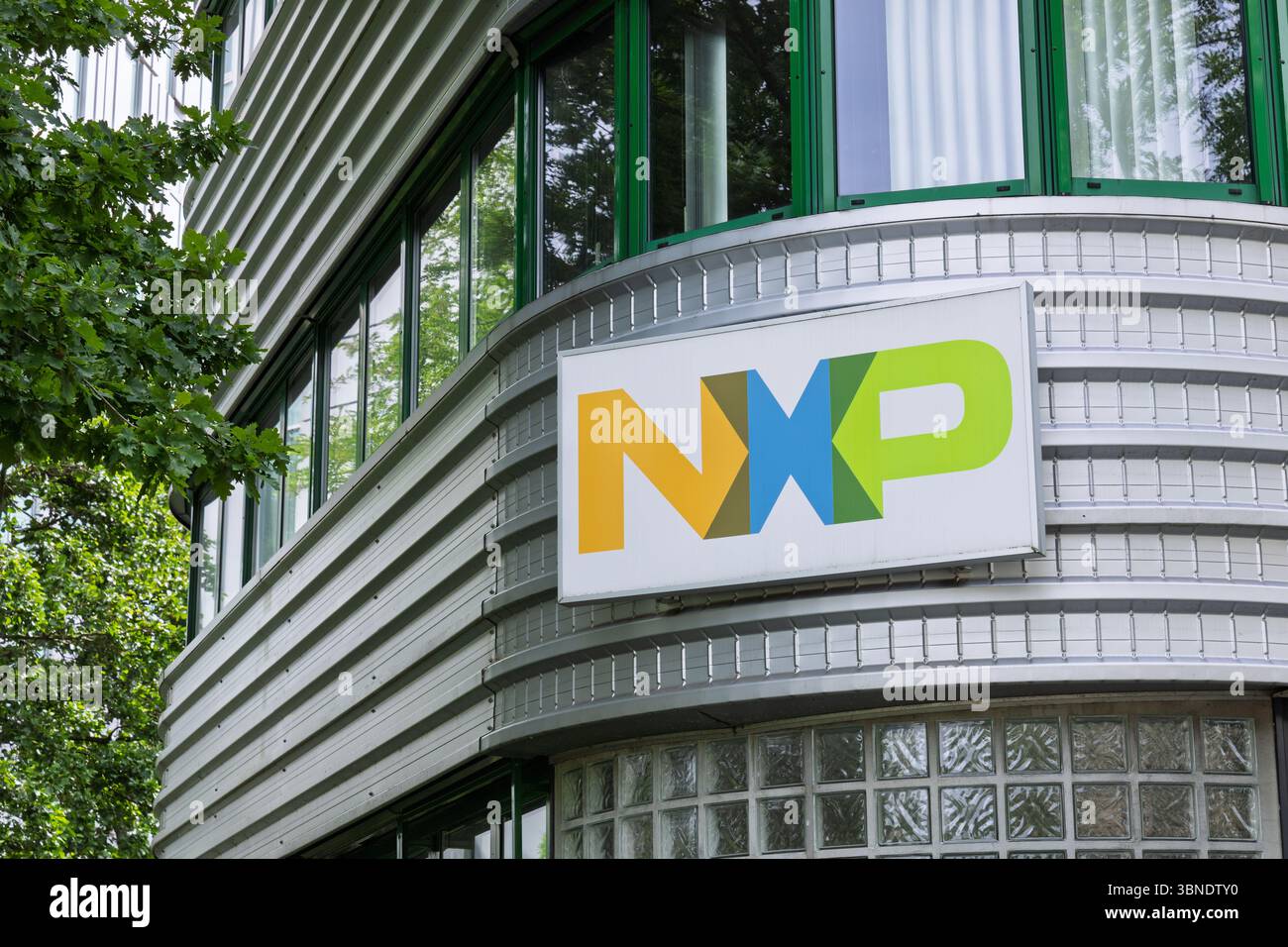 The NXP Semiconductors logo on a corporate building facade ...
