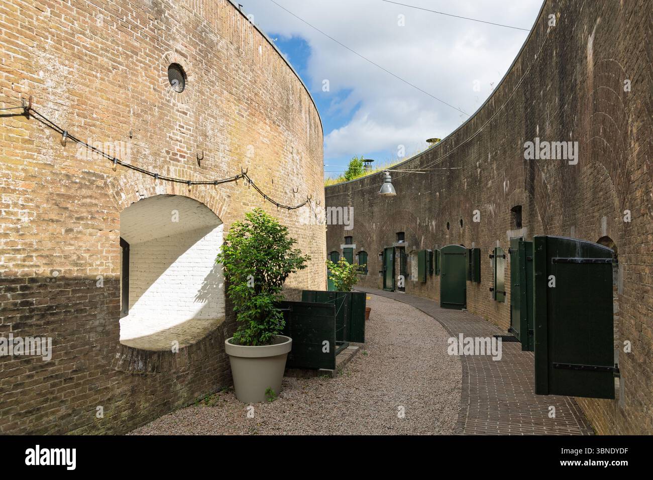 Curved brick walls of Fort Vuren create a unique passage with old ...