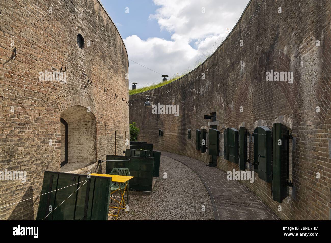 Curved brick walls of Fort Vuren create a unique passage with old ...