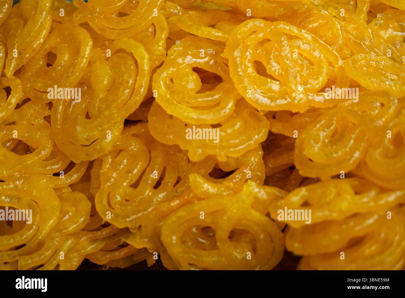Jalebi is a famous indian sweet. frying sweets jalebi in oil, indian ...