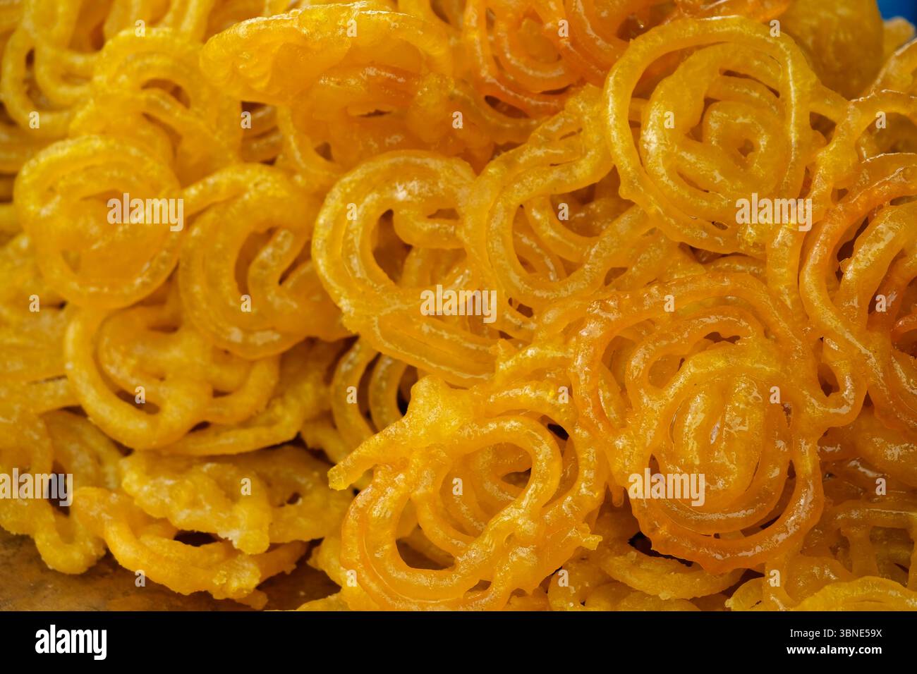 Jalebi is a famous indian sweet. frying sweets jalebi in oil, indian ...