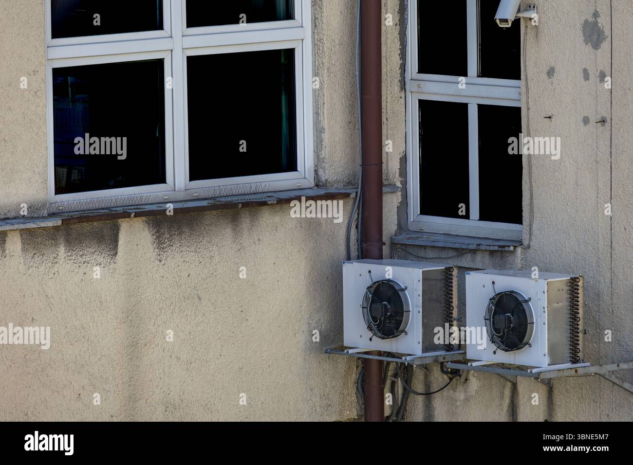 Old damaged air conditioners requiring maintenance and fungicides ...