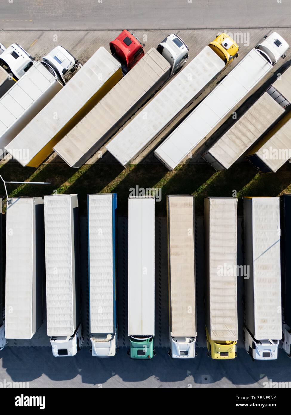Aerial view of a large truck parking lot at a logistics hub, with ...