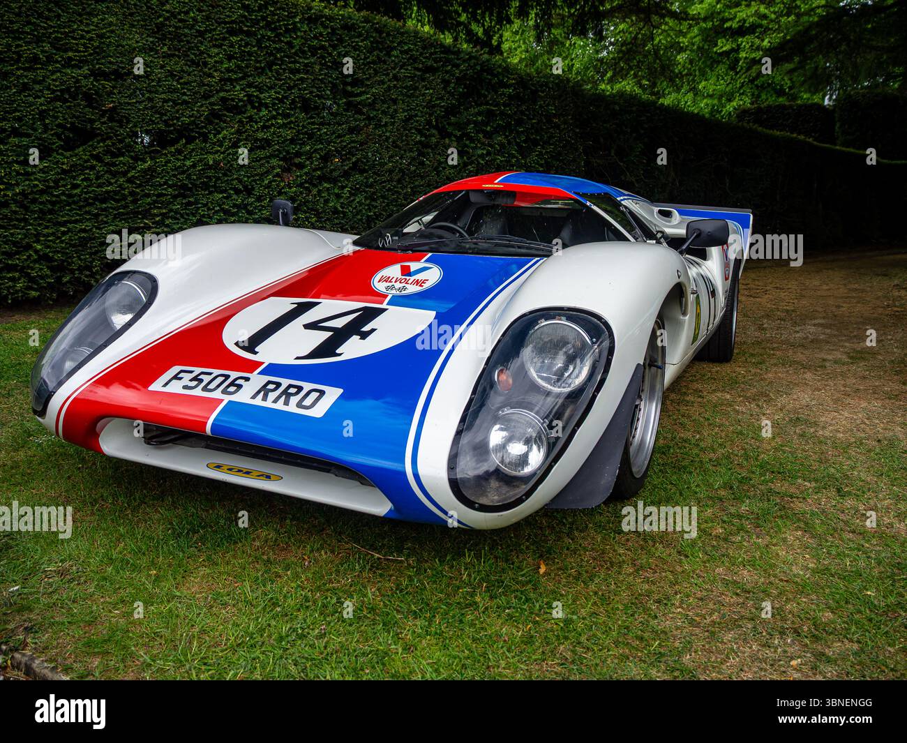 Lola T70 Mk3B 5.0 (2023 GTD replica) parked on a lawn framed by a ...