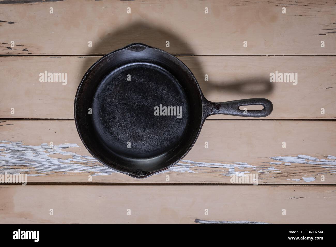 Top-down view of a small cast iron skillet with an integrated iron ...