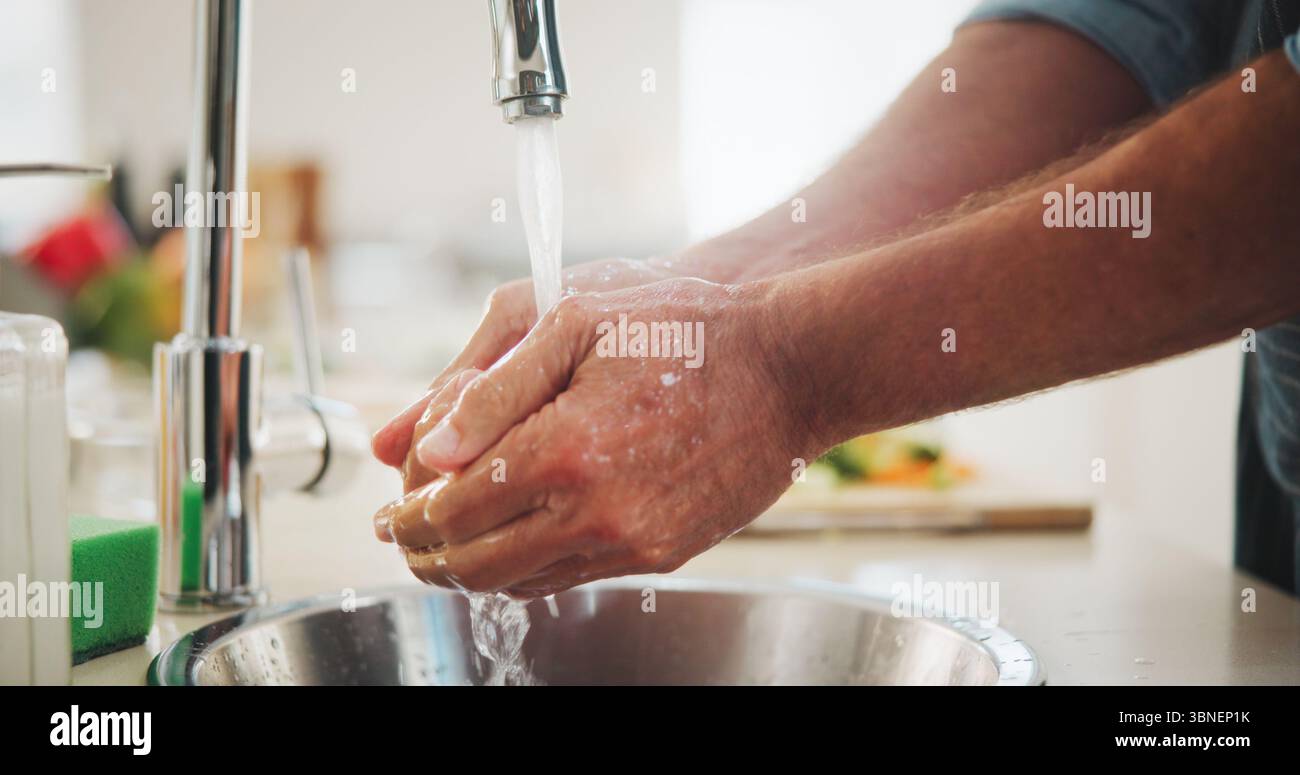 Hygiene, cooking and man washing hands in kitchen for germ protection ...