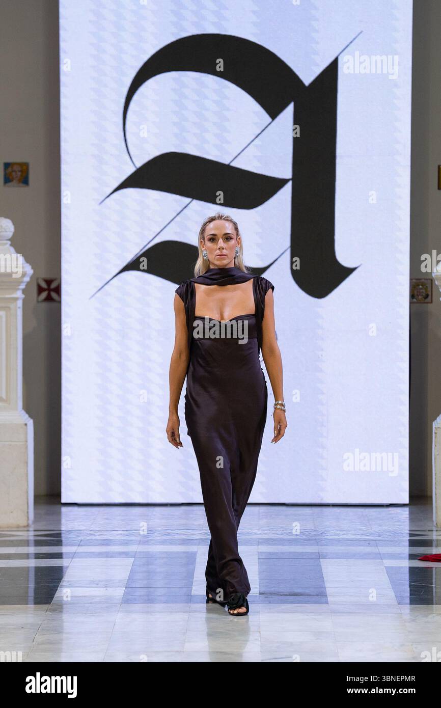 BANGKOK, THAILAND - JUNE 30: A model walks the runway for the Maison ...