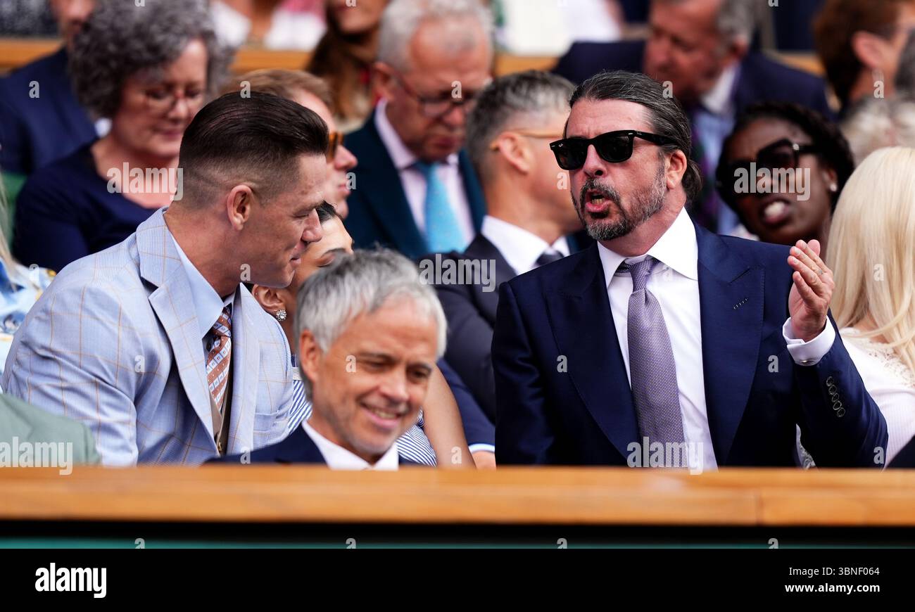 Dave Grohl speaking with John Cena in the Royal Box on day three of the ...