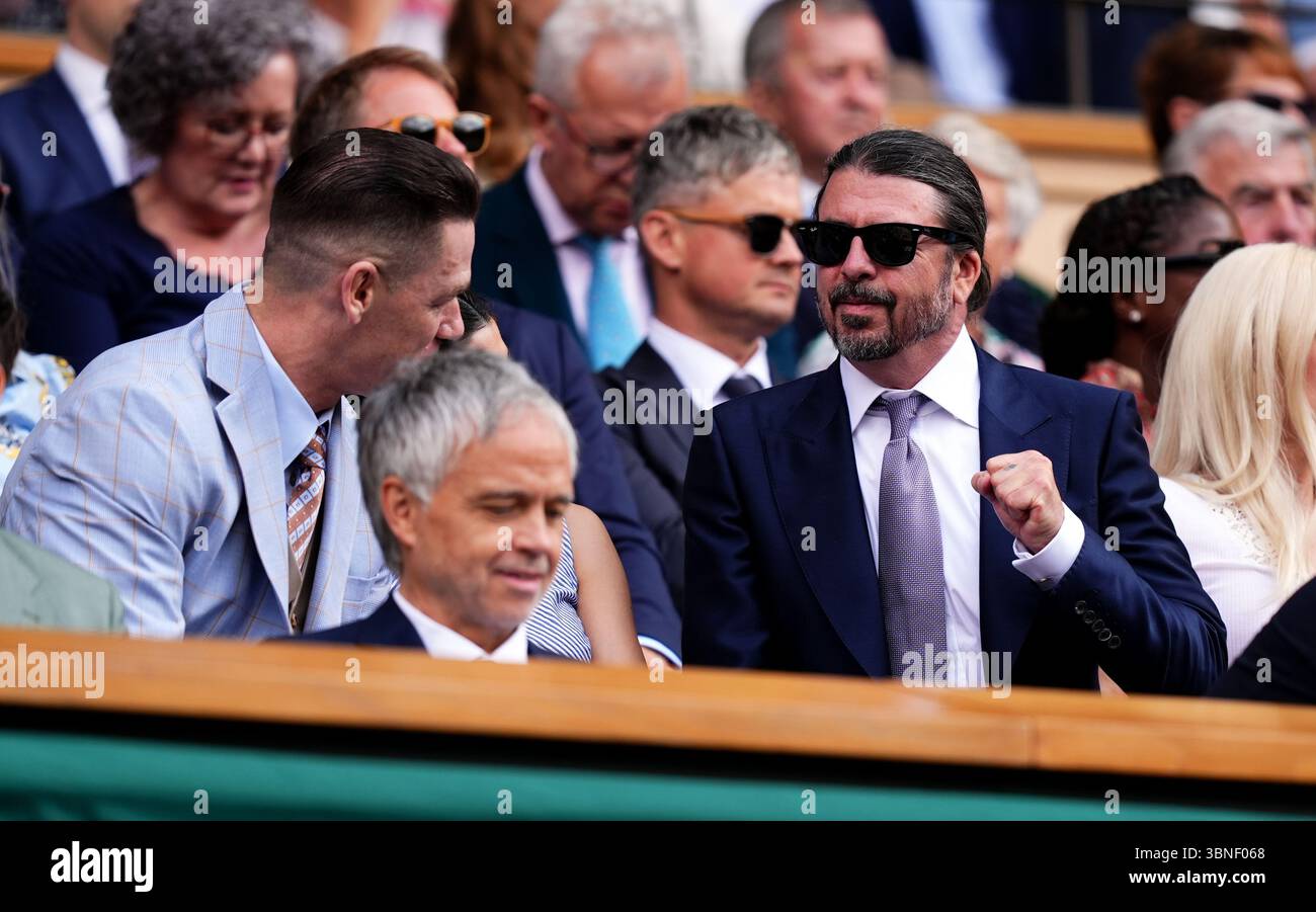 Dave Grohl speaking with John Cena in the Royal Box on day three of the ...