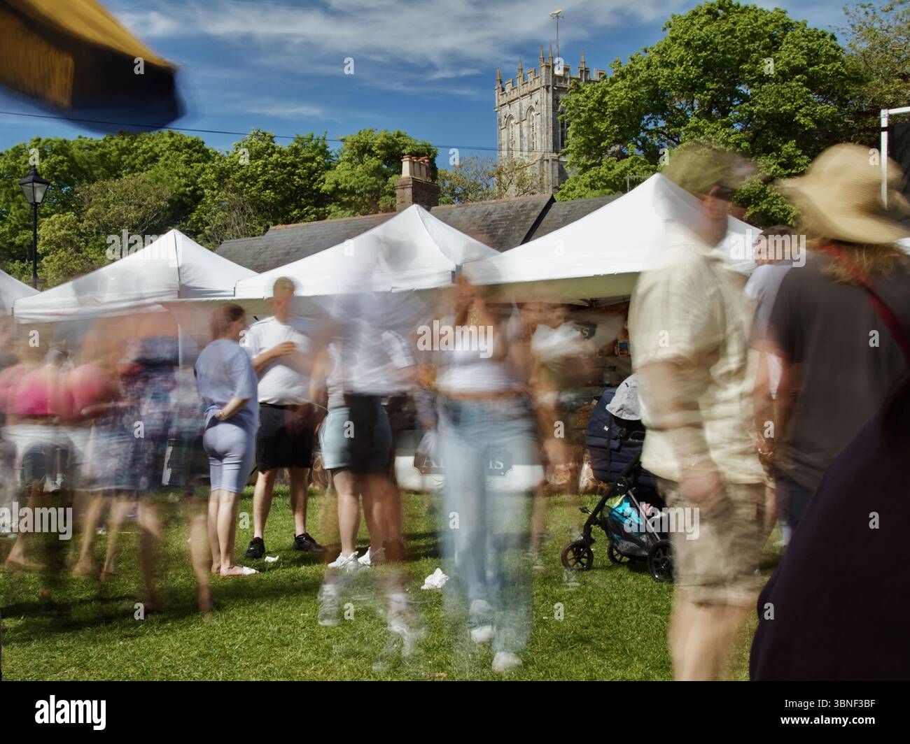 People walking past tents hi-res stock photography and images - Alamy