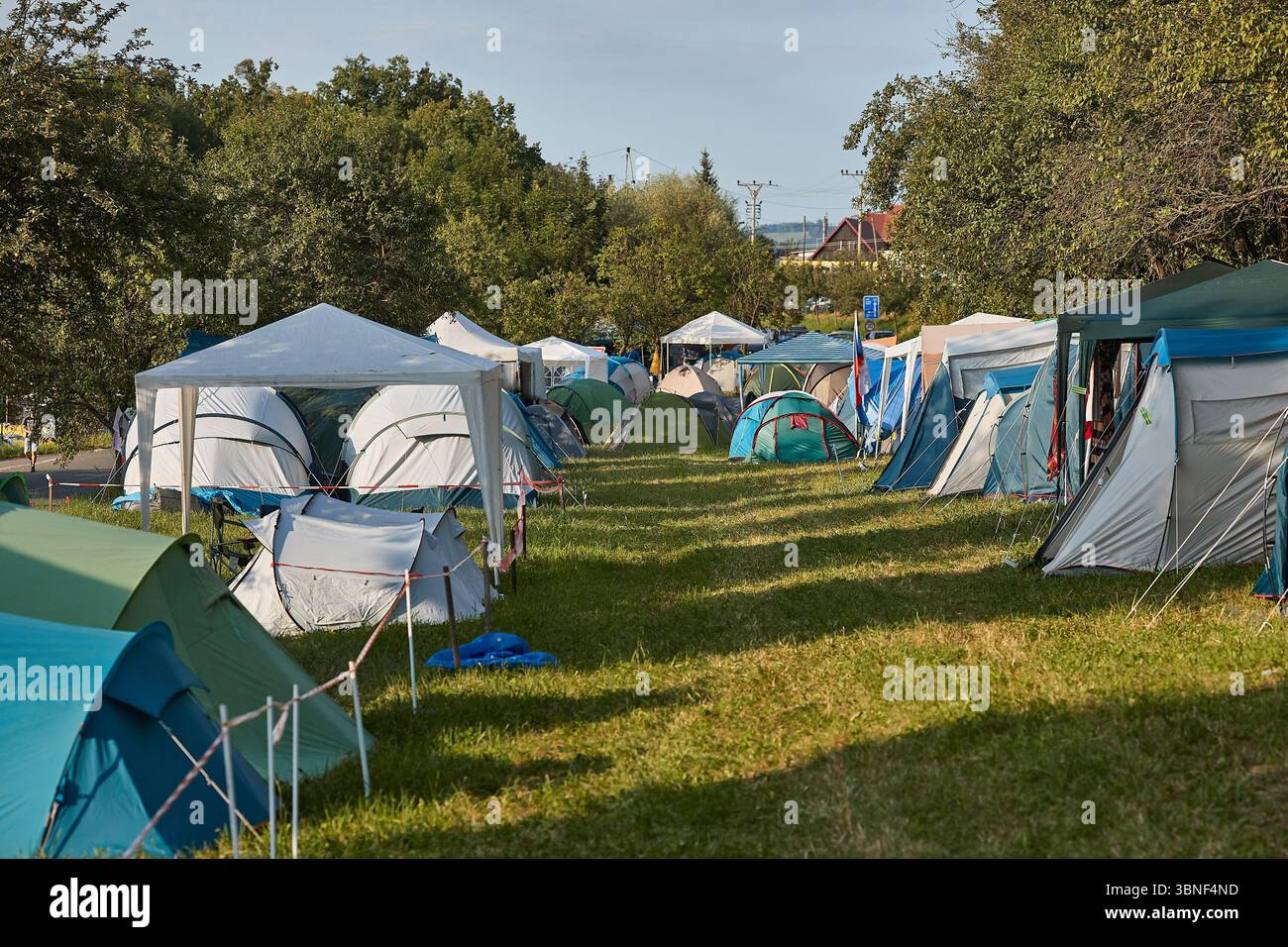 Tents group camping on a meadow Stock Photo - Alamy