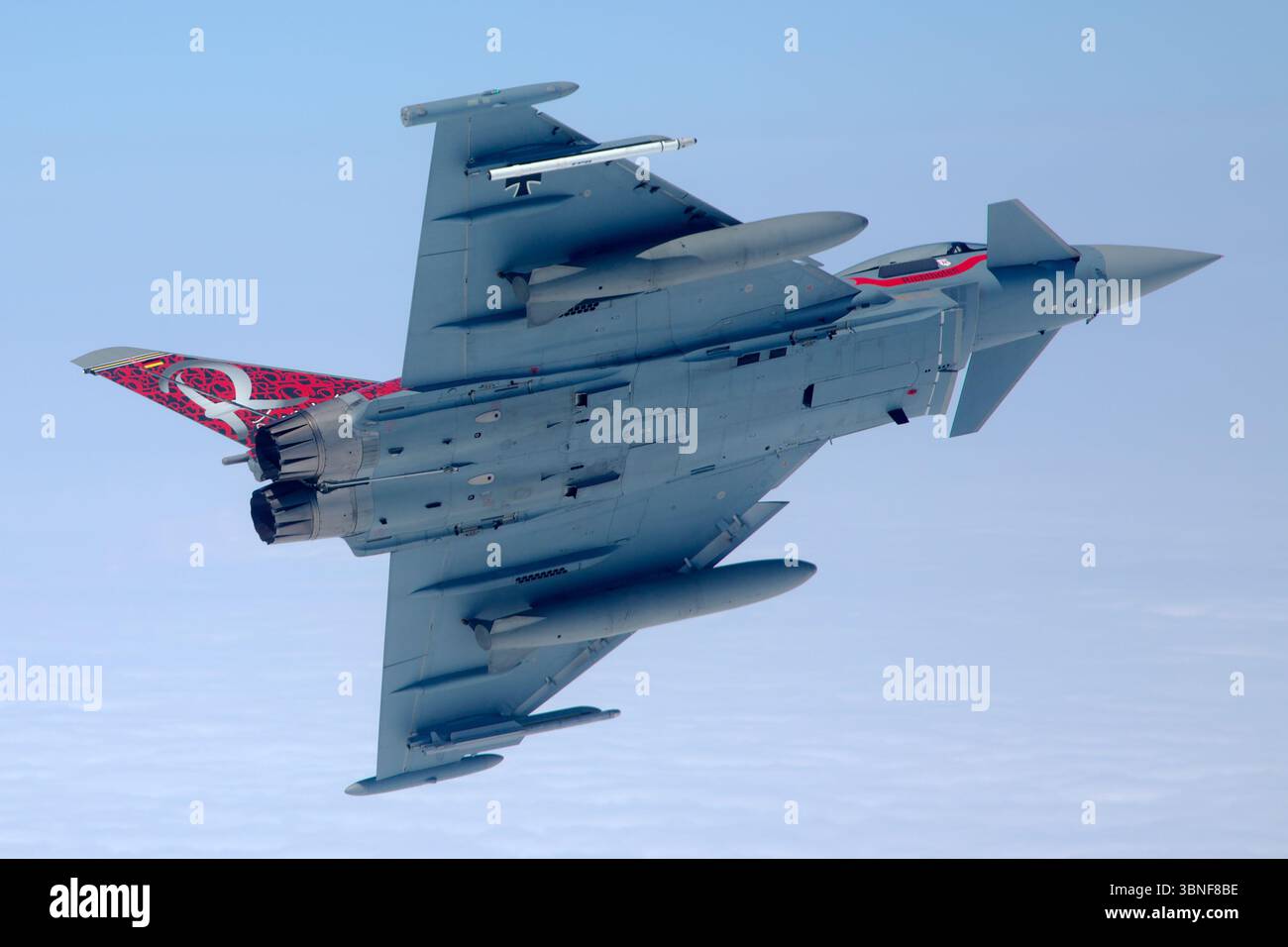 The German Air Force’s Eurofighter EF-2000 Typhoon S (Reg. 3090) is captured mid-flight over ...