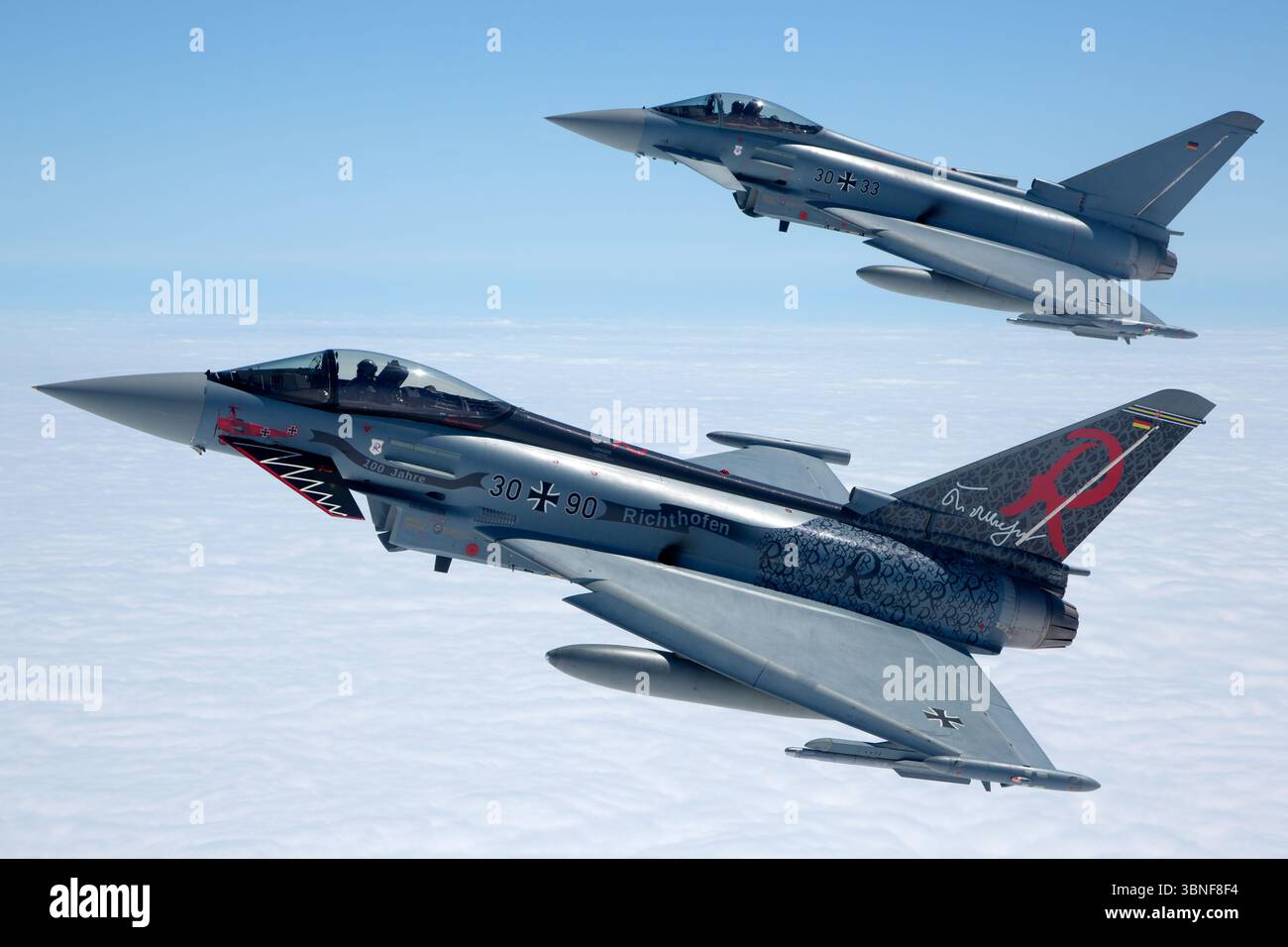 The German Air Force’s Eurofighter EF-2000 Typhoon S aircraft (Reg. 3090 and 3033) form a tight ...