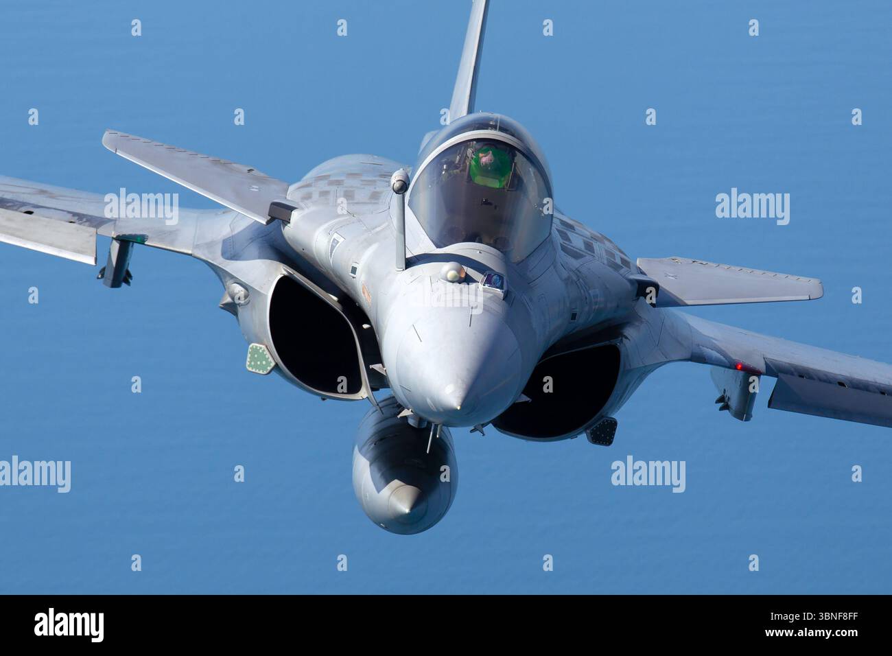 A French Navy Rafale M naval multirole fighter performs a tactical pass ...