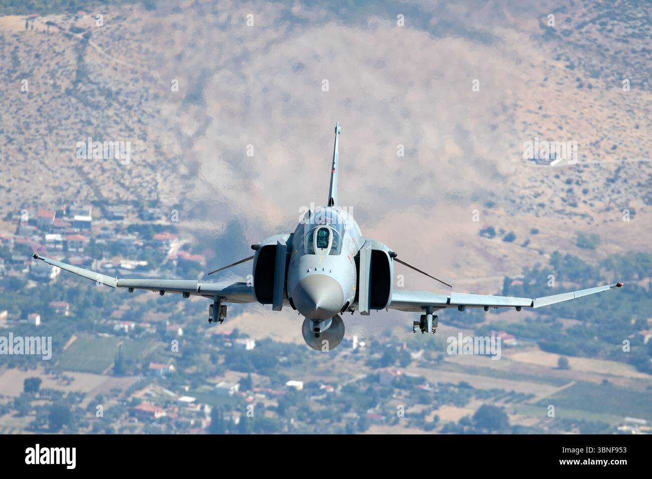 A HAF McDonnell Douglas F‑4E AUP Phantom II approaches the photo ship ...