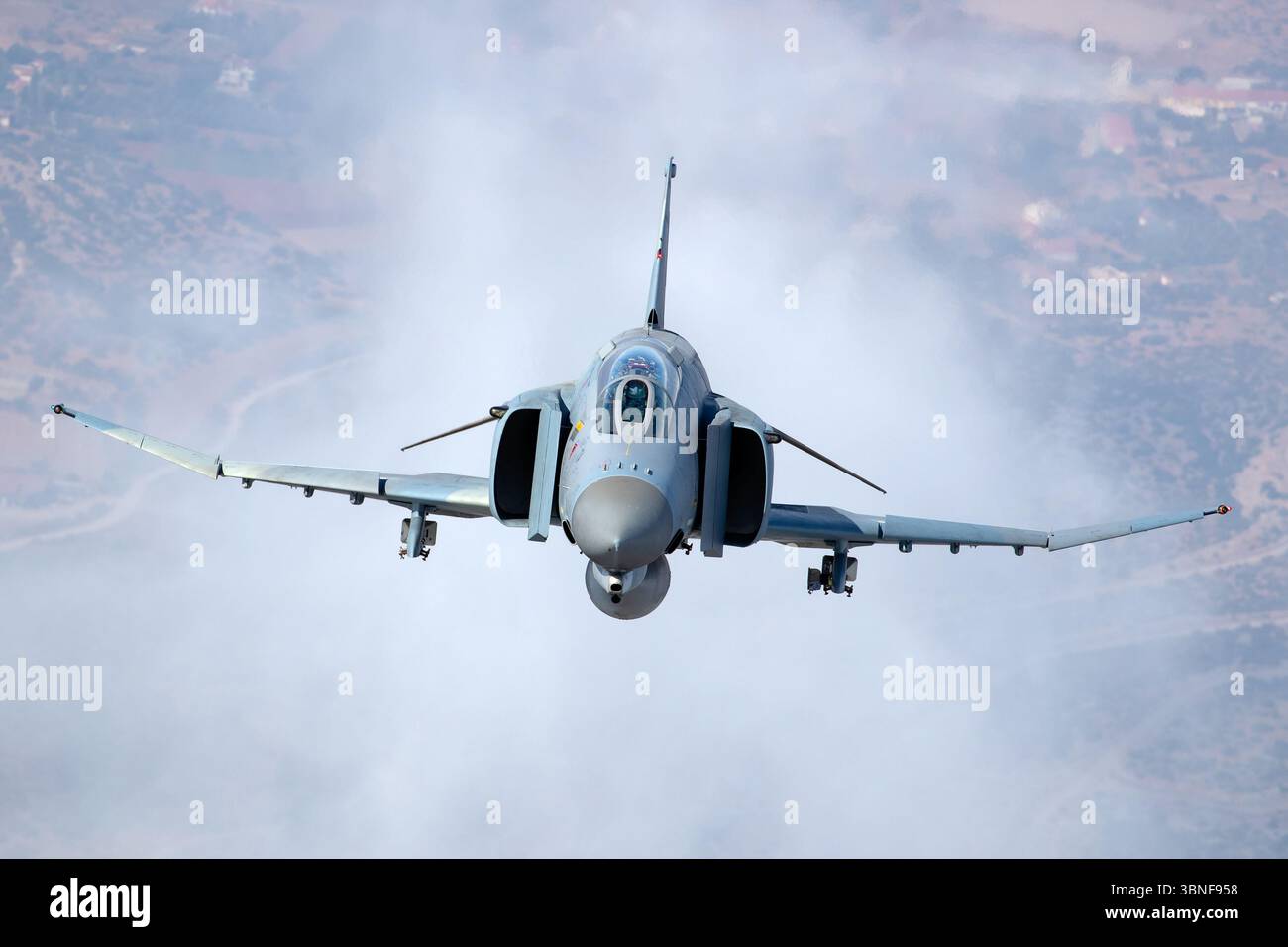 The McDonnell Douglas F-4E AUP Phantom II (Reg. 01518) of the Greek Hellenic Air Force is a ...