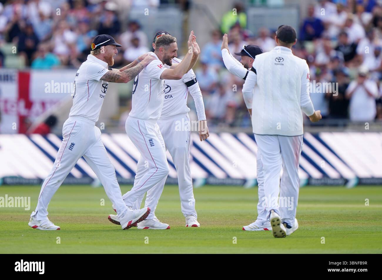England's Chris Woakes (centre left) celebrates with team-mates after ...