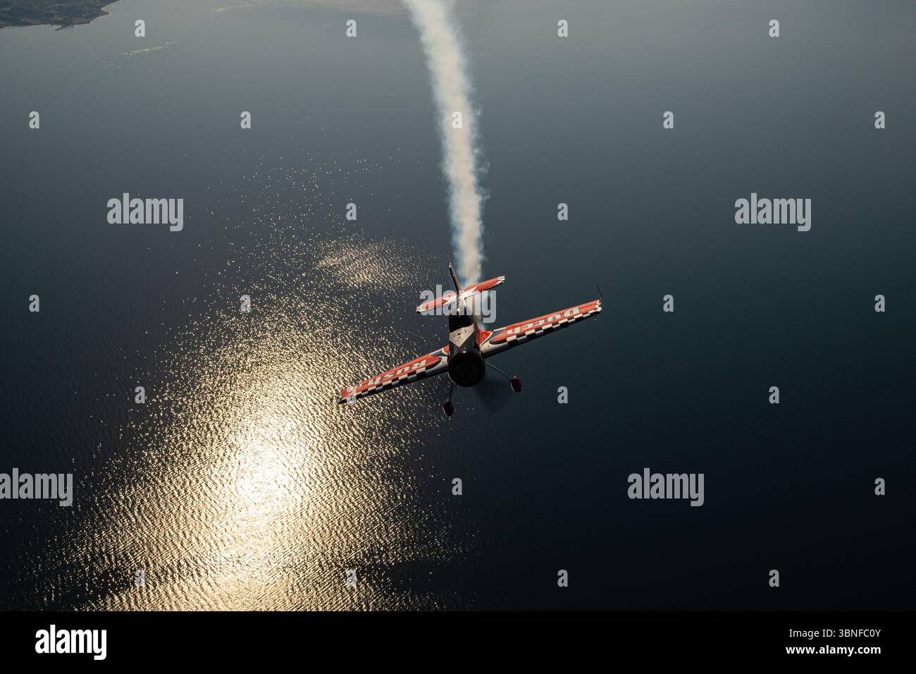 The Dutch Rush Aerobatics Sukhoi Su-26MX releases a plume of smoke as ...