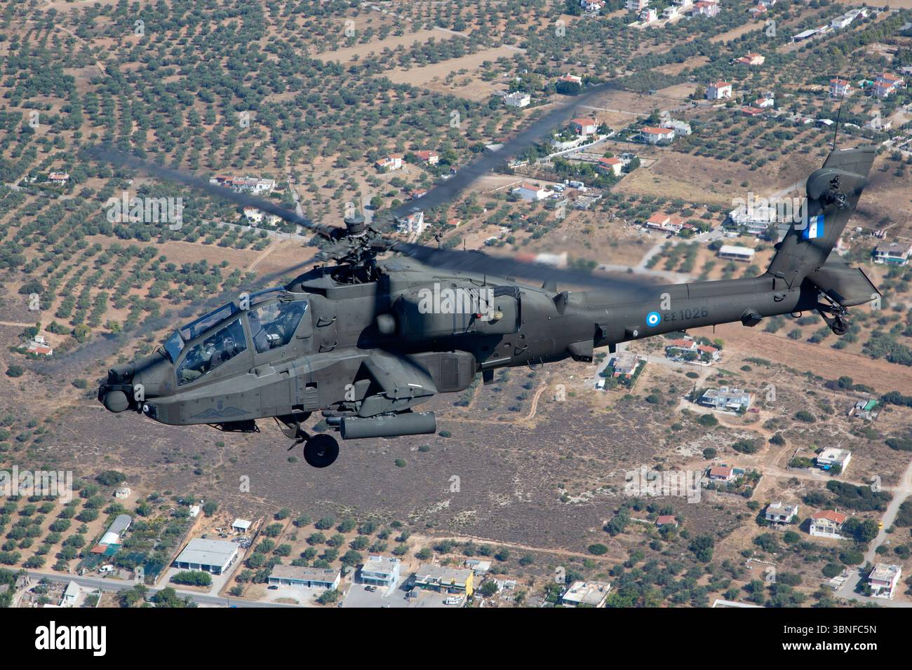 The Boeing AH-64DHA Apache, tail number ES1026, is a multirole attack ...