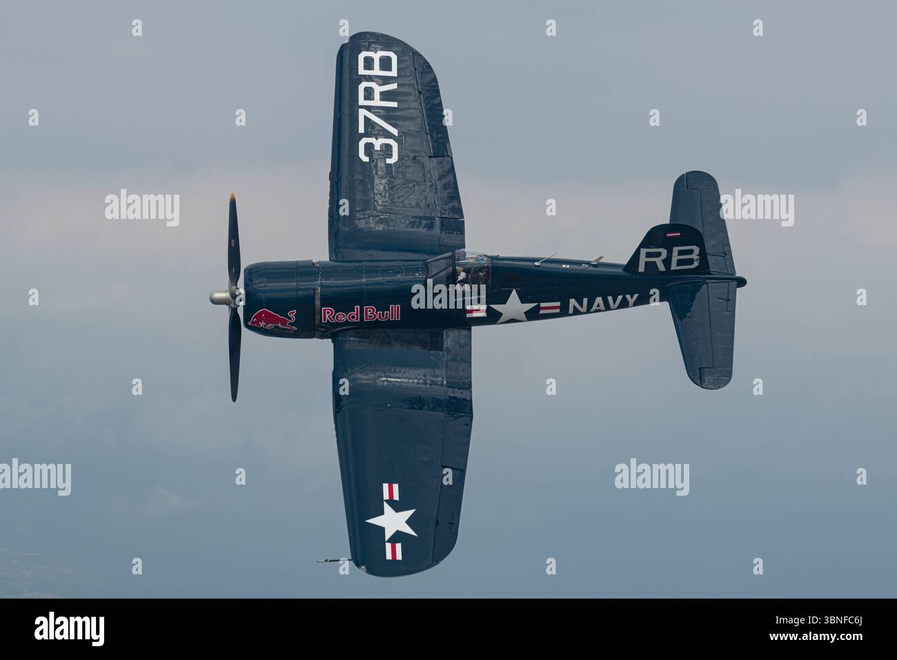 The Vought F4U-4 Corsair (OE-EAS, Military Code 37RB) banks in flight ...