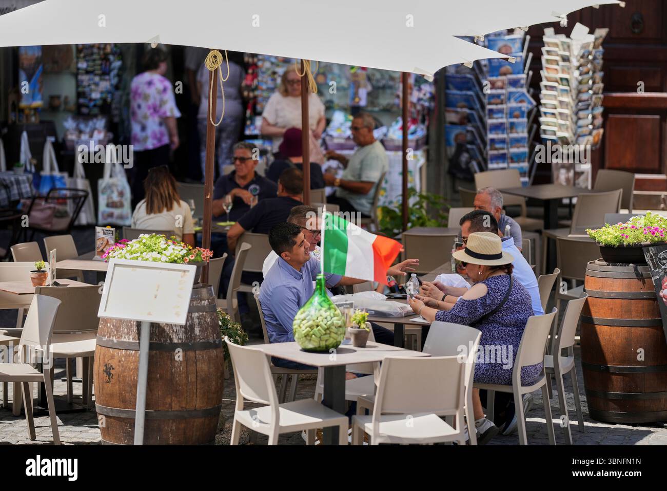 Customers enjoy drinks in the town of Castel Gandolfo, a historic ...