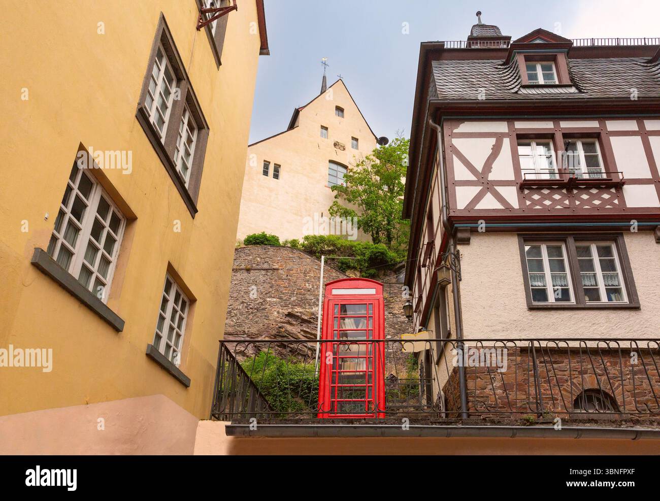 Red phone booth converted into public book exchange in Cochem, Germany ...