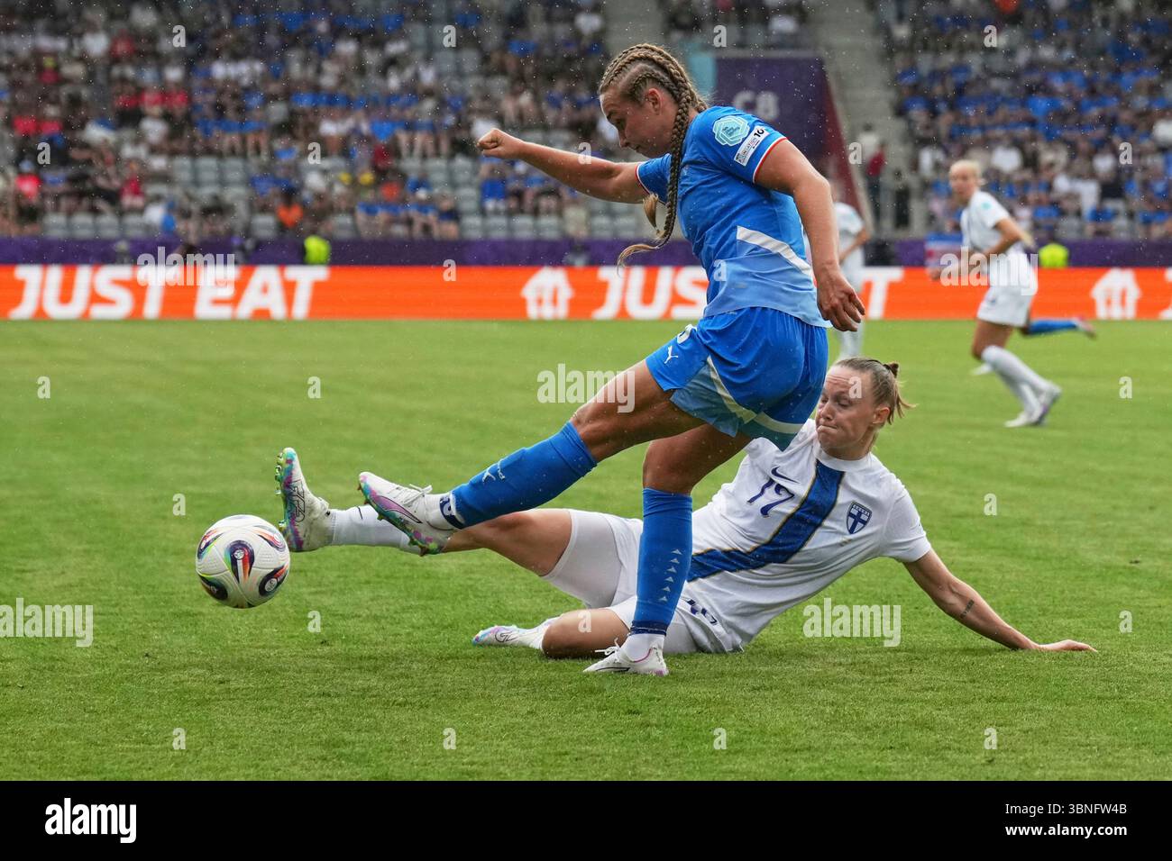 Finland 's Sanni Franssi, right, challenges for the ball with Iceland's ...
