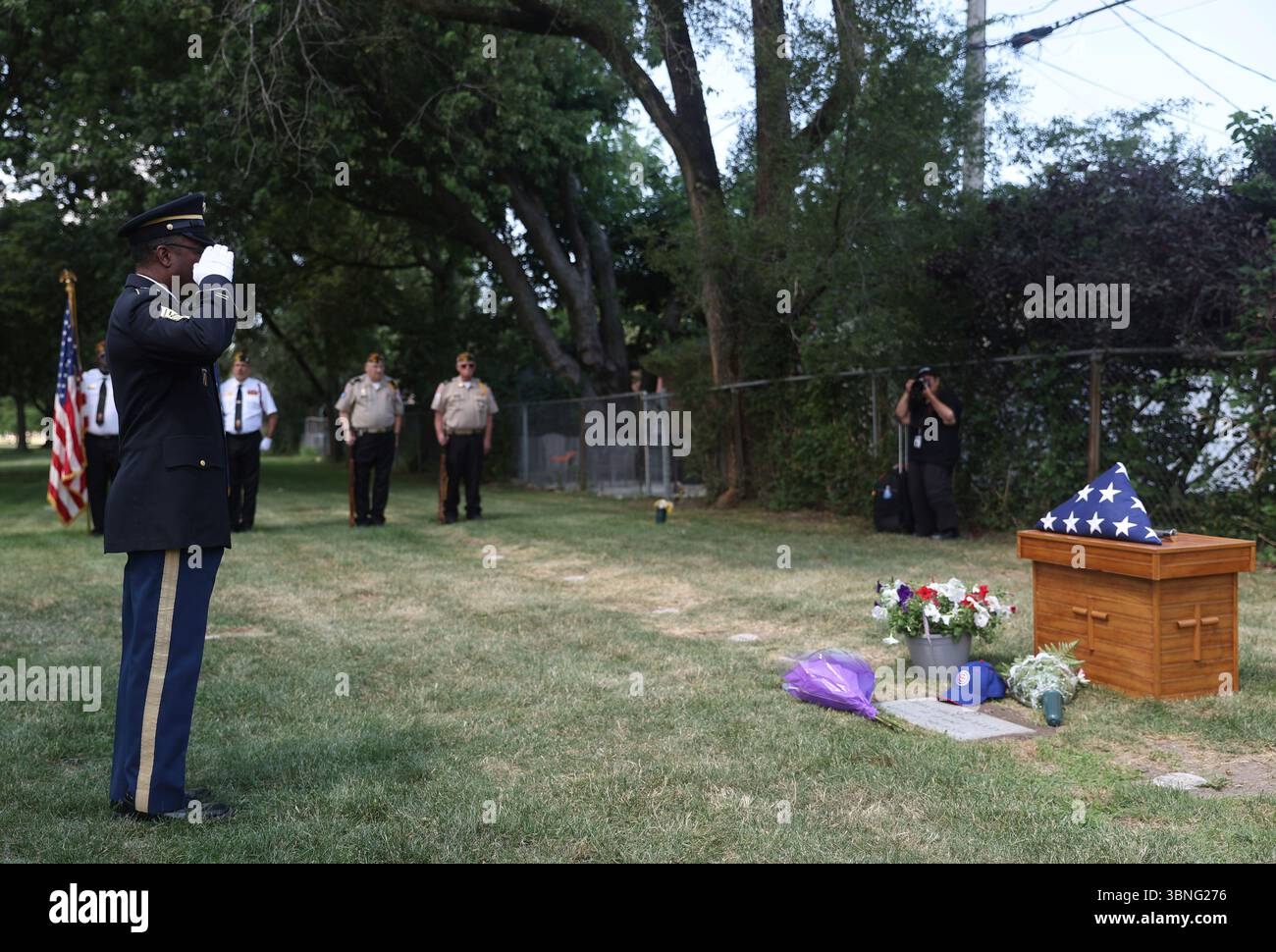 Master Sgt. Derrick Bailey salutes the grave of 75-year-old Pfc. Reba C ...