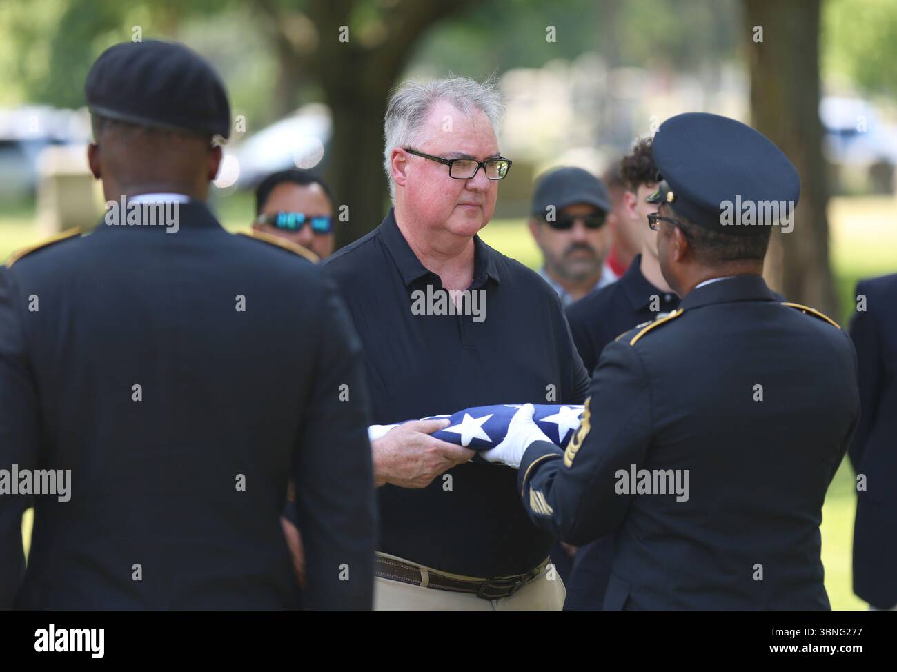 Staff Sgt. Kobe Green and Master Sgt. Derrick Bailey, right, present ...