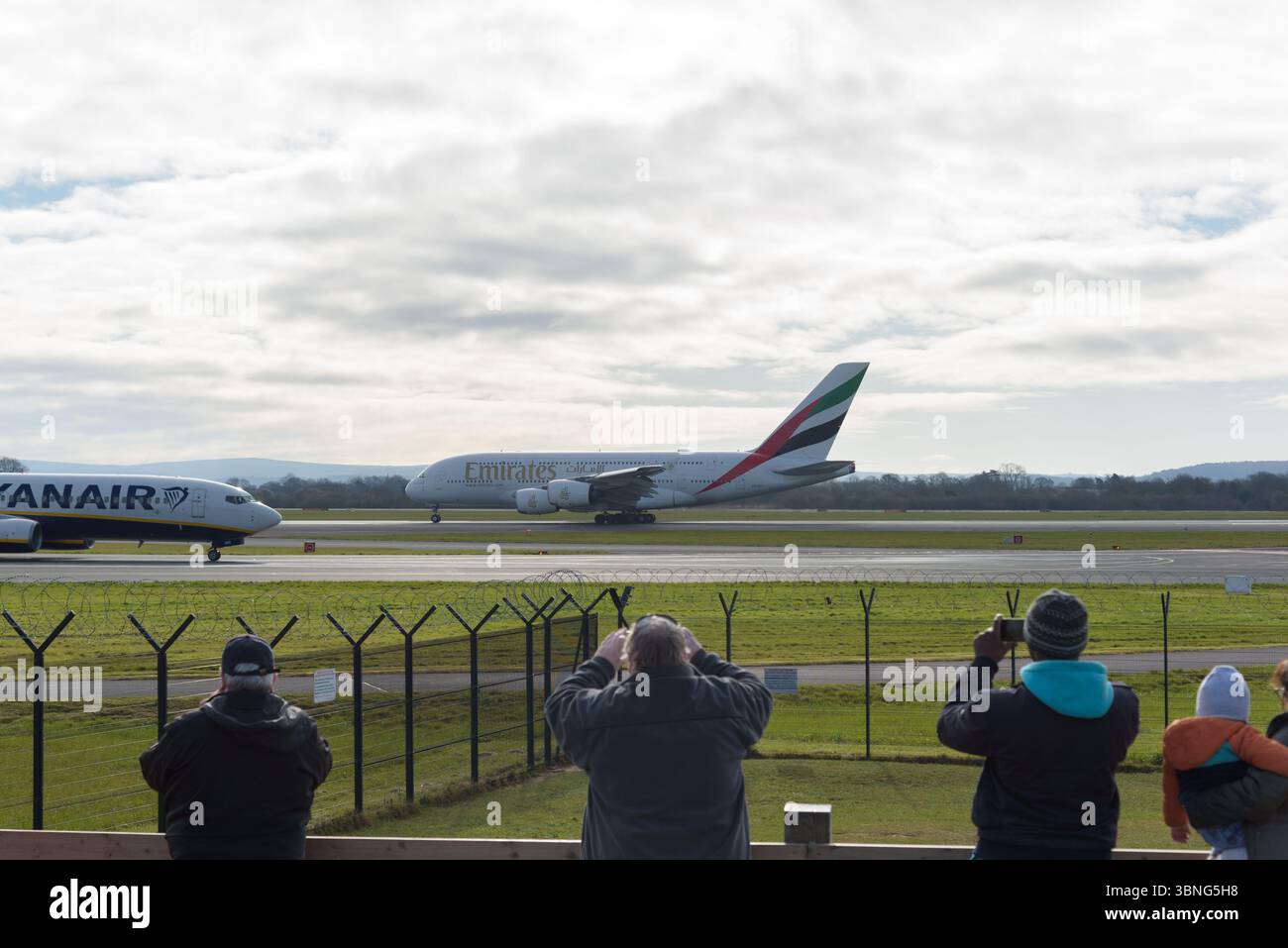 Plane spotters watching aircraft at Manchester international airport ...