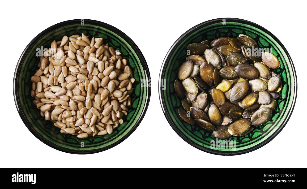 Pumpkin and sunflower seeds. Healthy snack in green ceramic bowls ...
