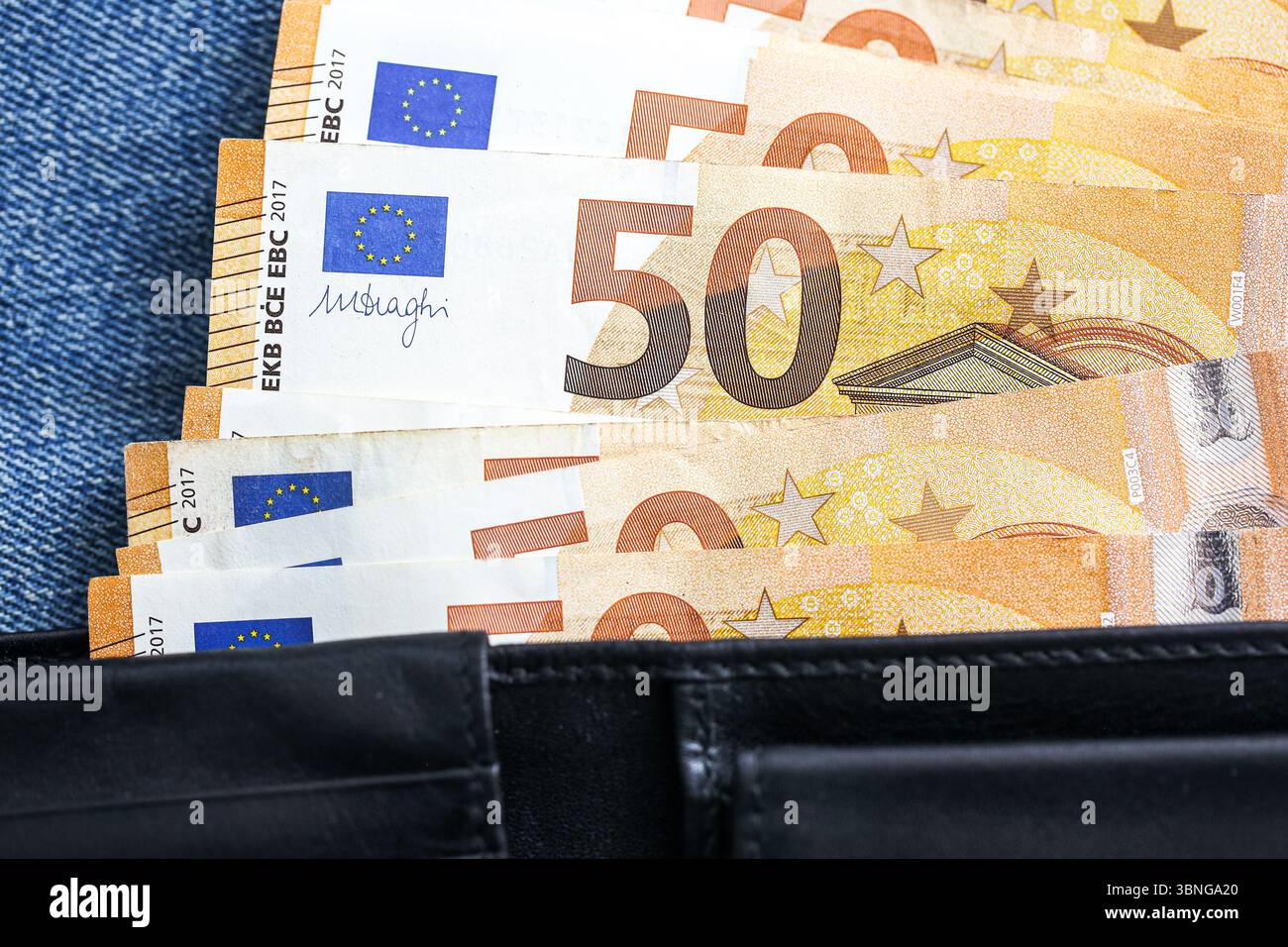Fifty euro banknotes. Money in denim pocket. Currency and savings ...