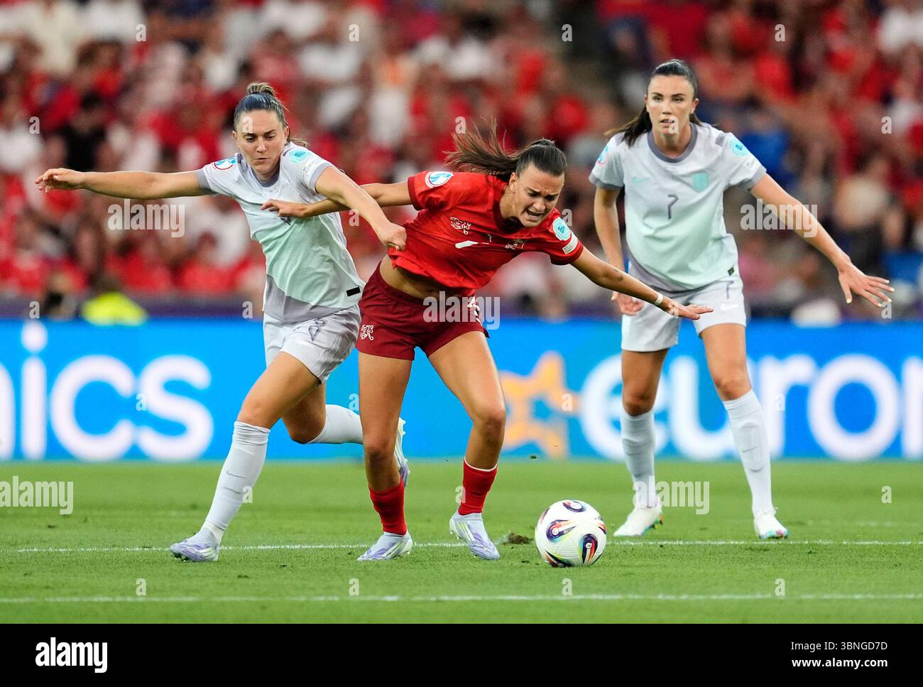 Switzerland's Riola Xhemaili (centre) battles for the ball with Norway ...