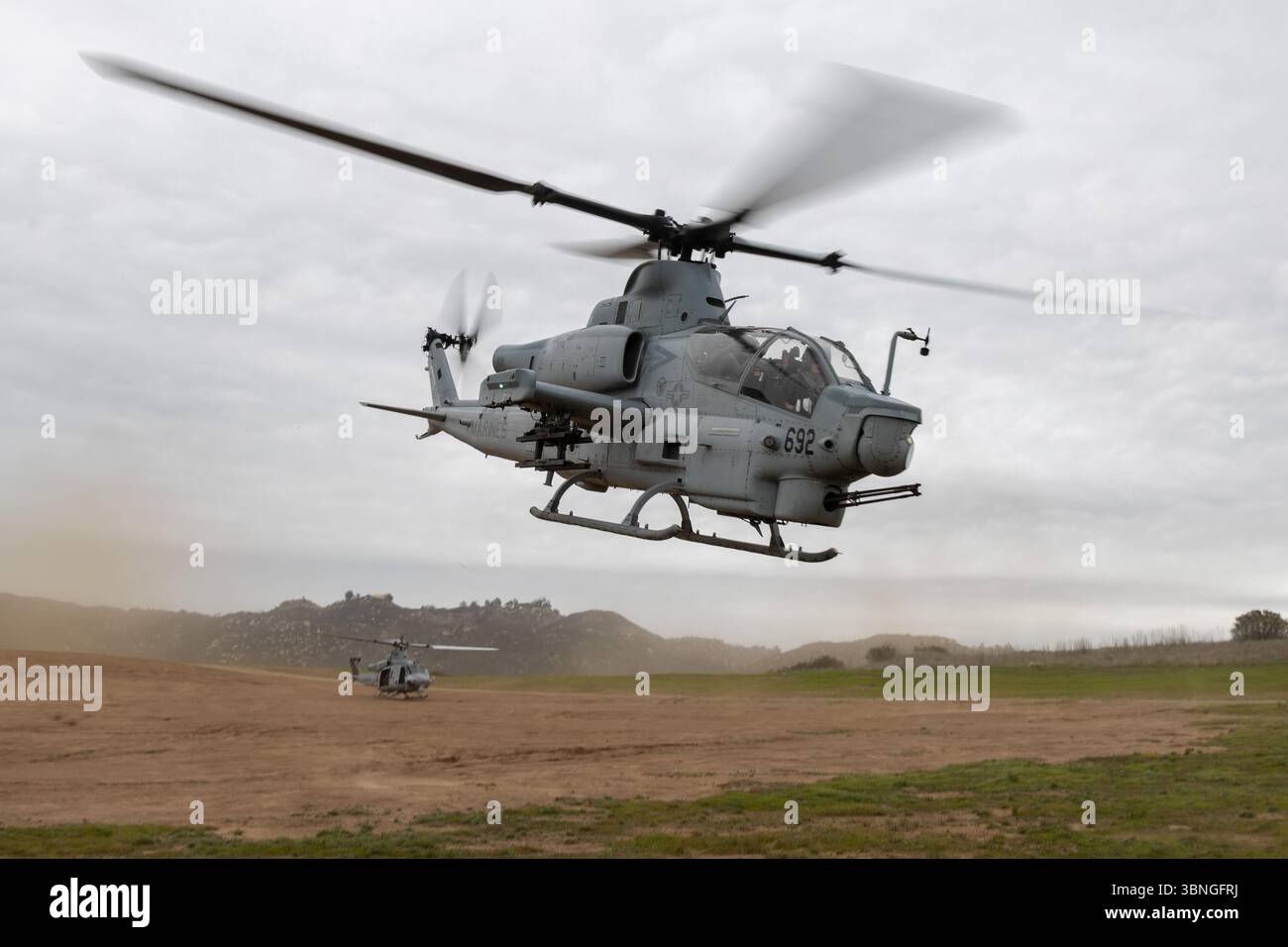A U.S. Marine Corps AH-1Z Viper and a UH-1Y Venom, both with Marine Light Attack Helicopter ...