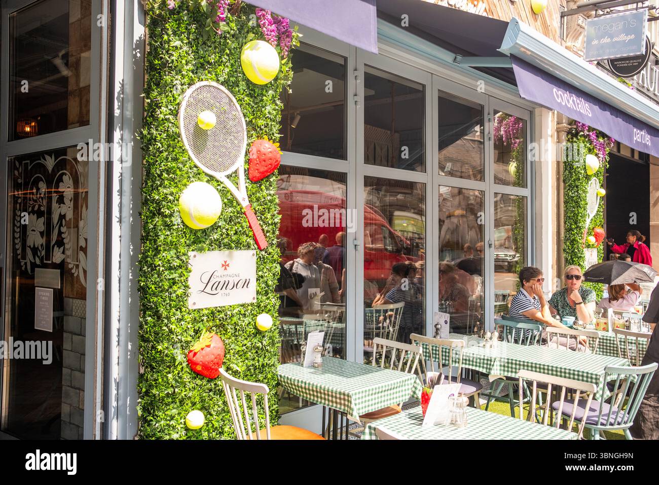 WIMBLEDON, LONDON- July 2, 2025: Tennis decorations and people in ...