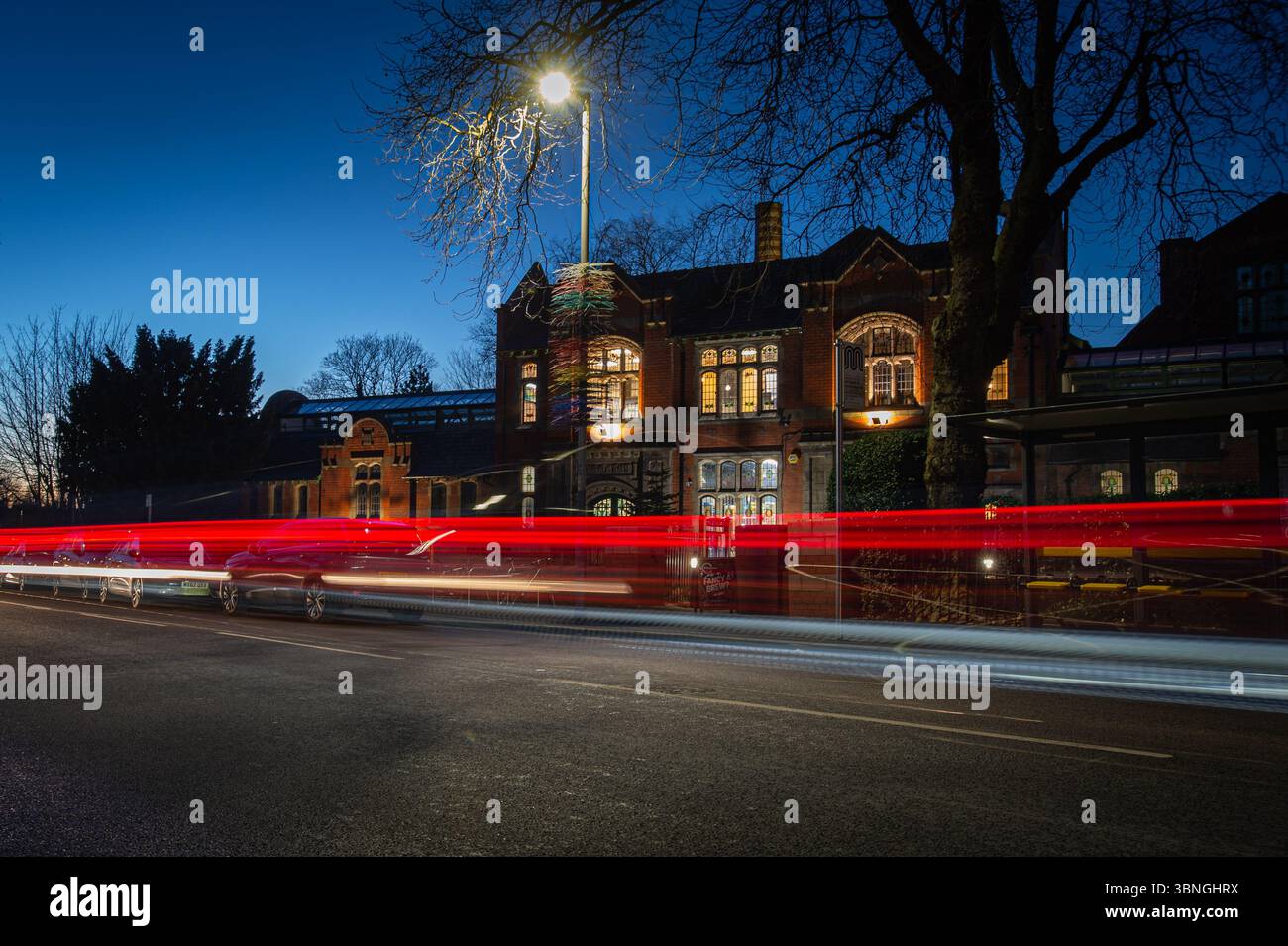 A night-time exterior view of Withington Leisure Centre in Withington ...