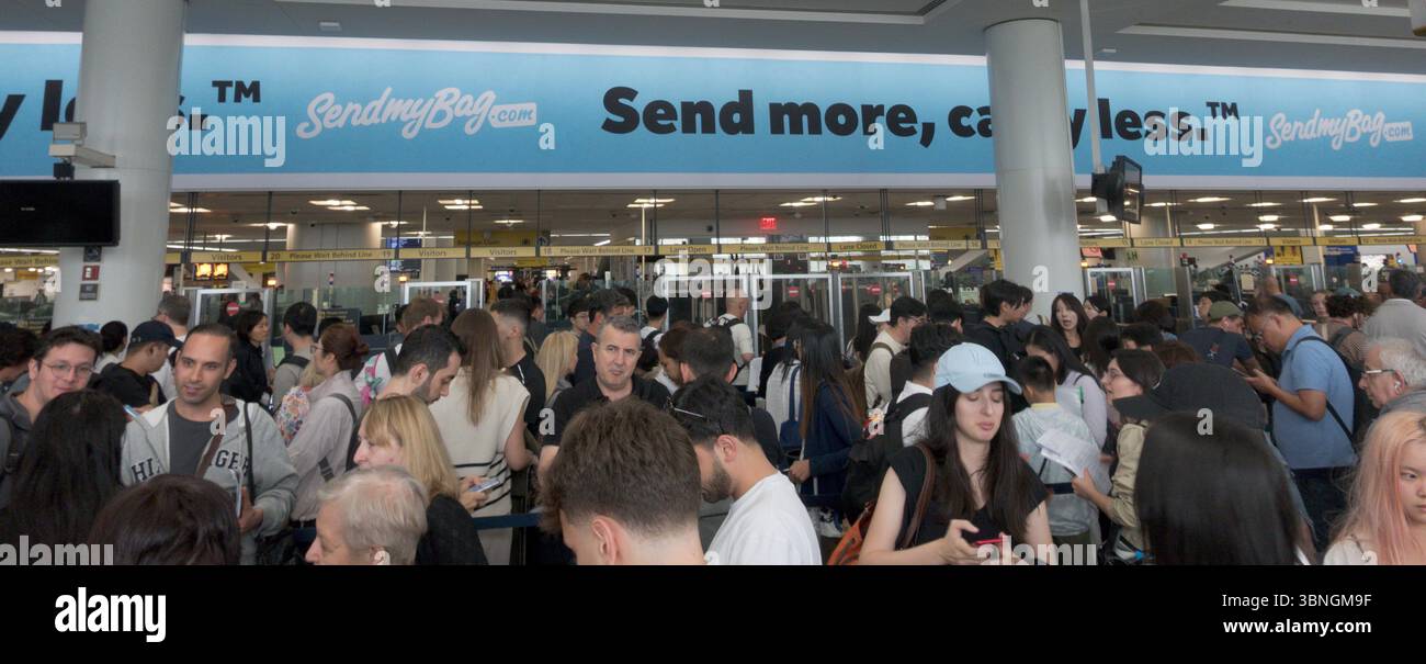 crowd of visitors waiting in long line in immigration queue, JFK ...
