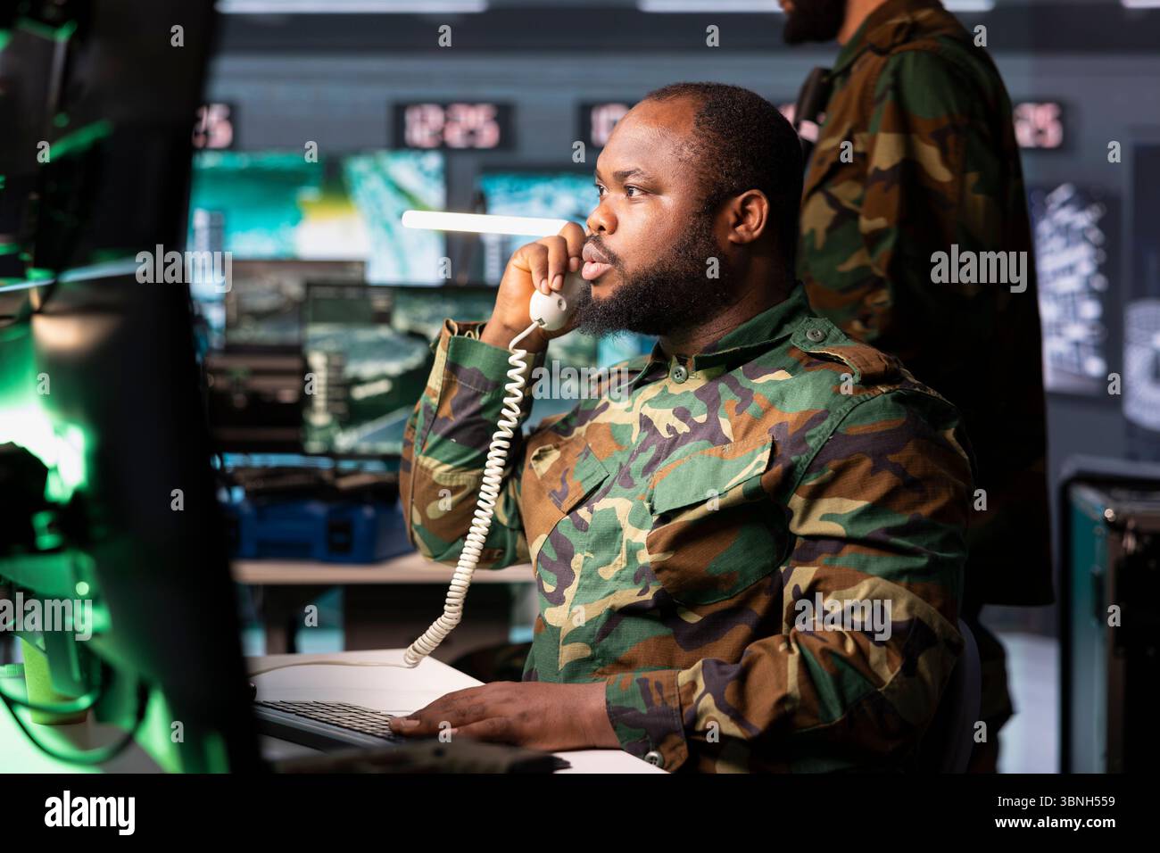 Intelligence officer using communication systems to call in air strikes ...