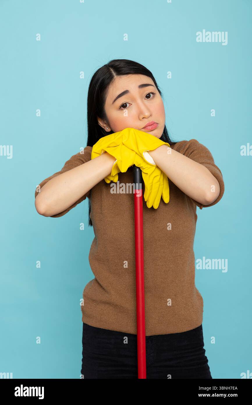 Cleaning lady standing unhappy after hi-res stock photography and ...