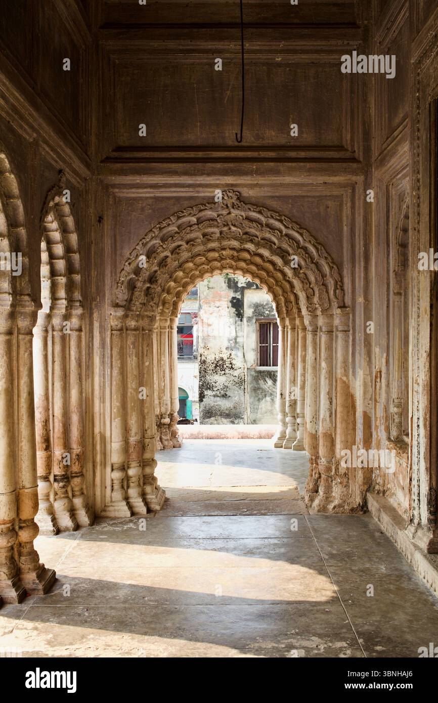 A sunlit corridor inside Puthia’s Shiva Temple reveals crumbling ...