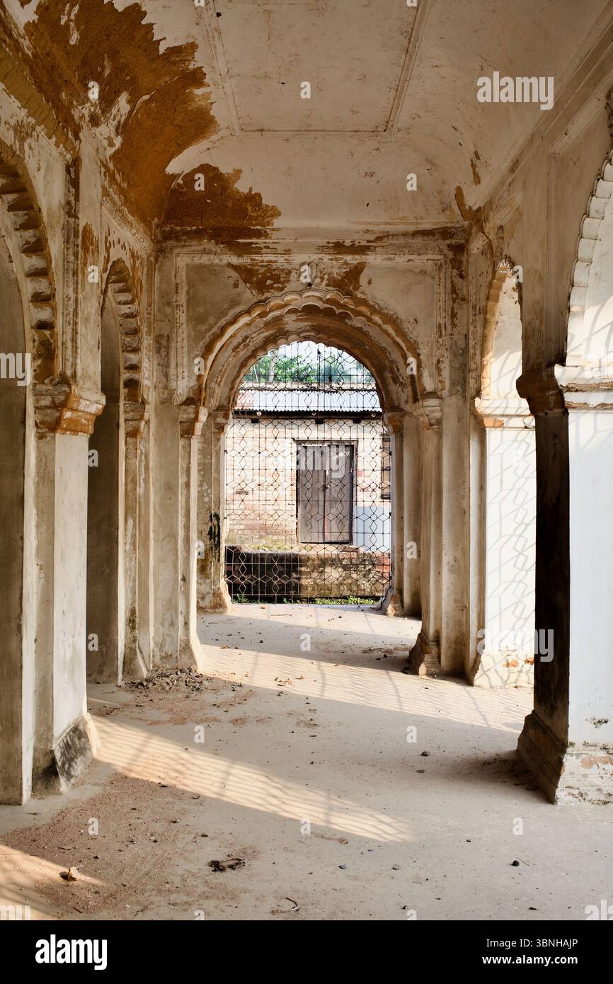 A sunlit corridor inside Puthia’s Shiva Temple reveals crumbling ...