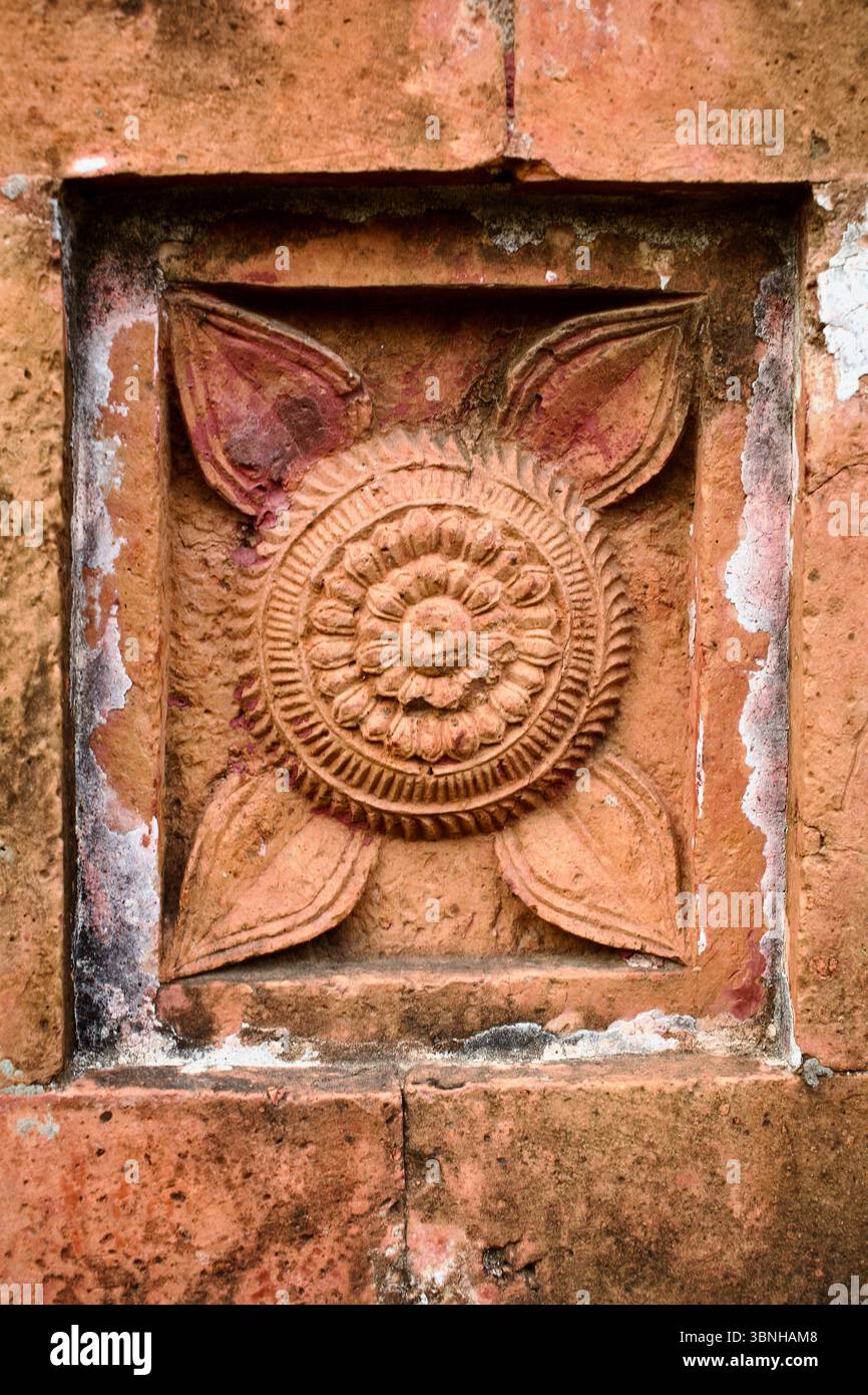 Close-up of a floral terracotta motif on the outer wall of Pancha Ratna ...