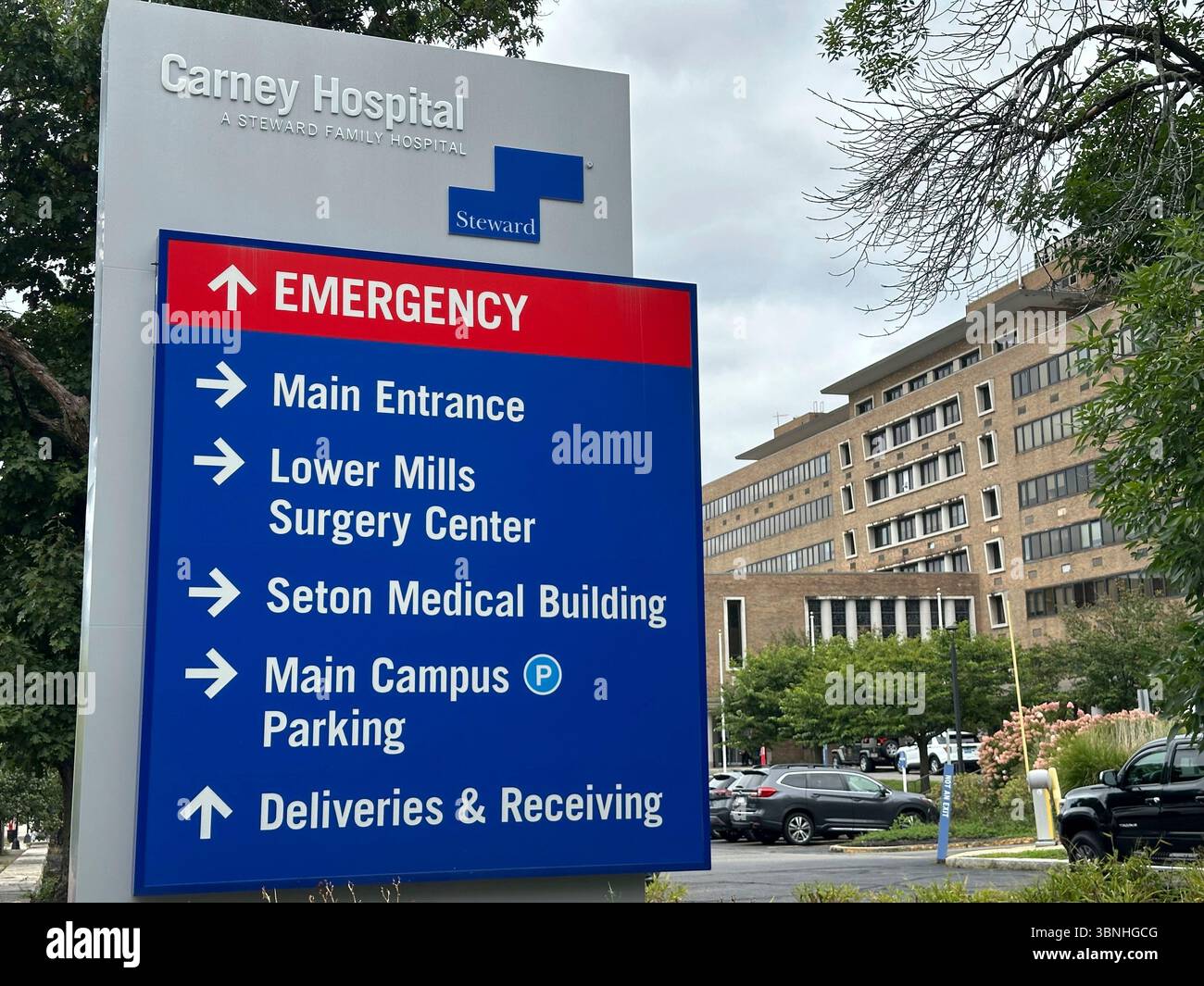 FILE - A direction board stands outside Carney Hospital in Boston, Aug ...